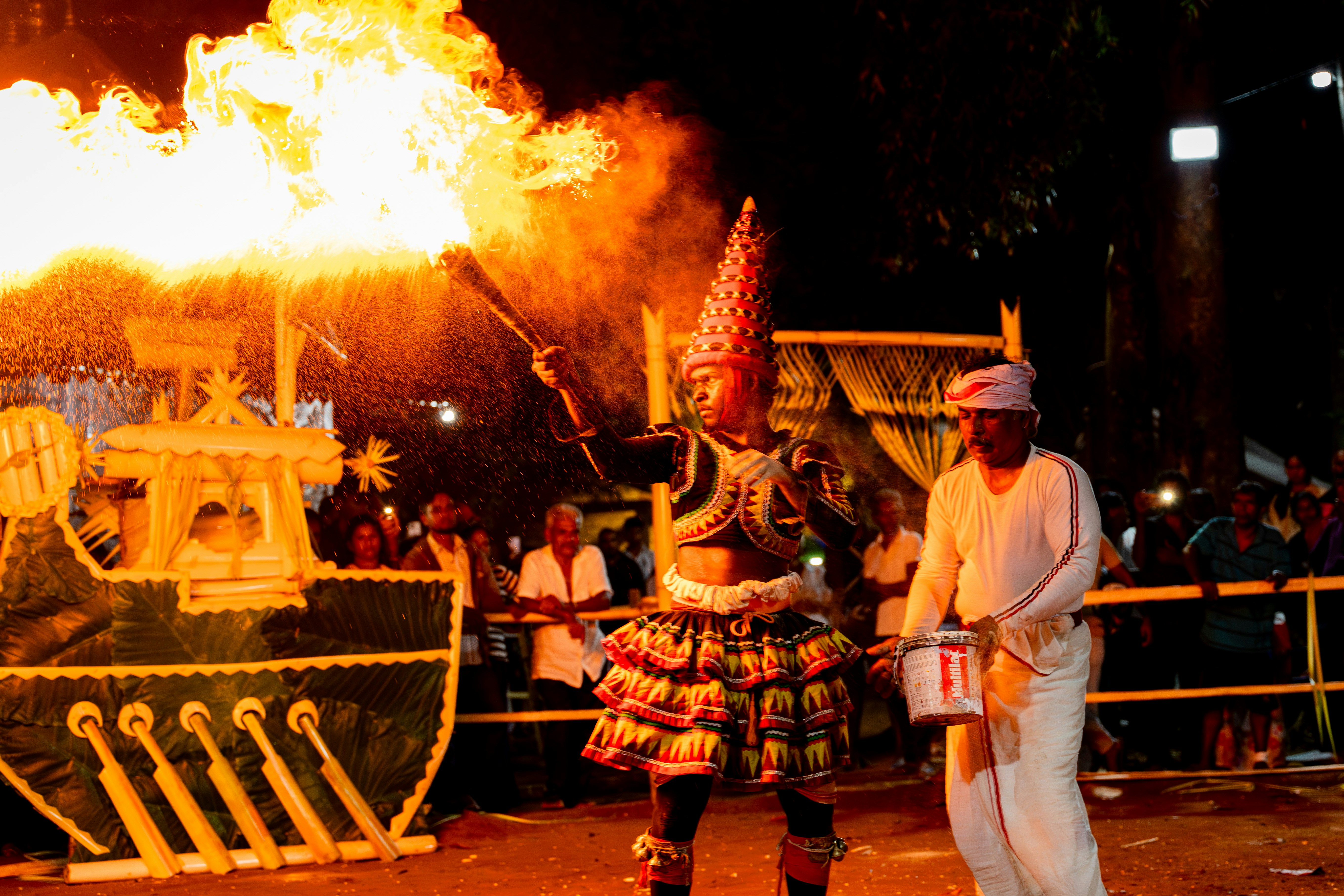 Inferno on Wheels: A Fire-Pueled Parade Amid Nighttime Festivities