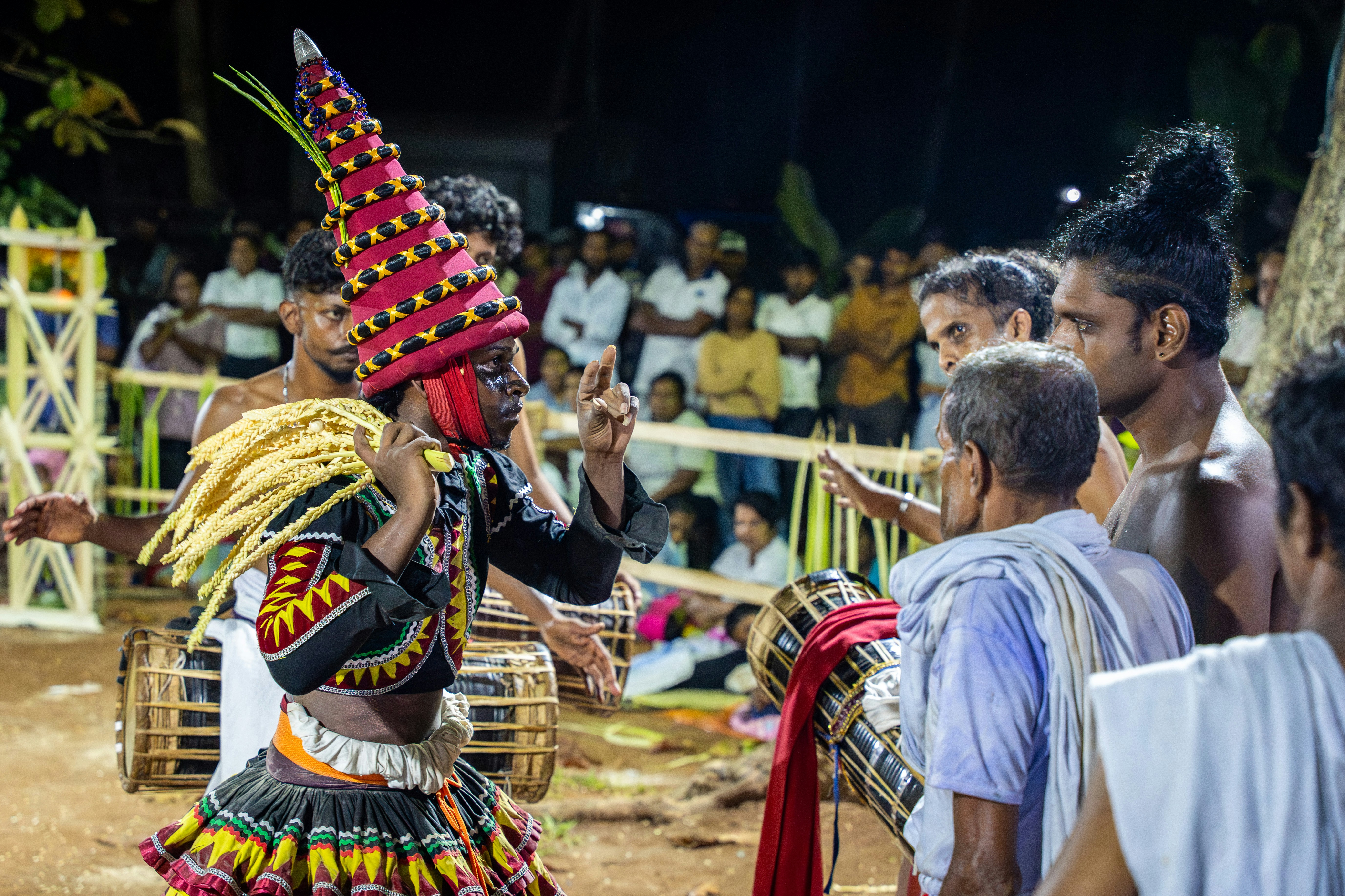 Masked Dancer at Night: A Bursting Circle of Color and Drum