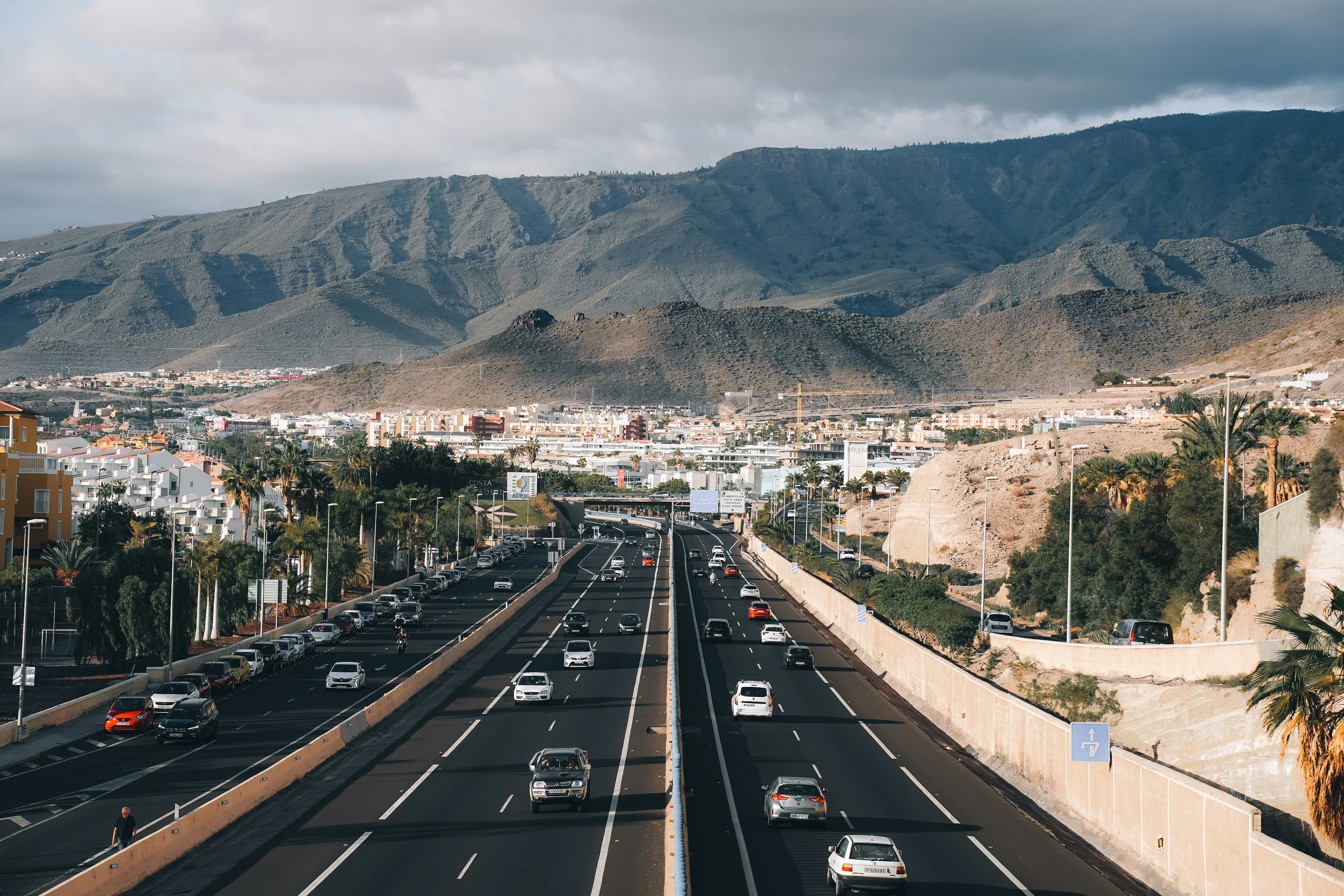 Broad desert highway under a canyon skyline