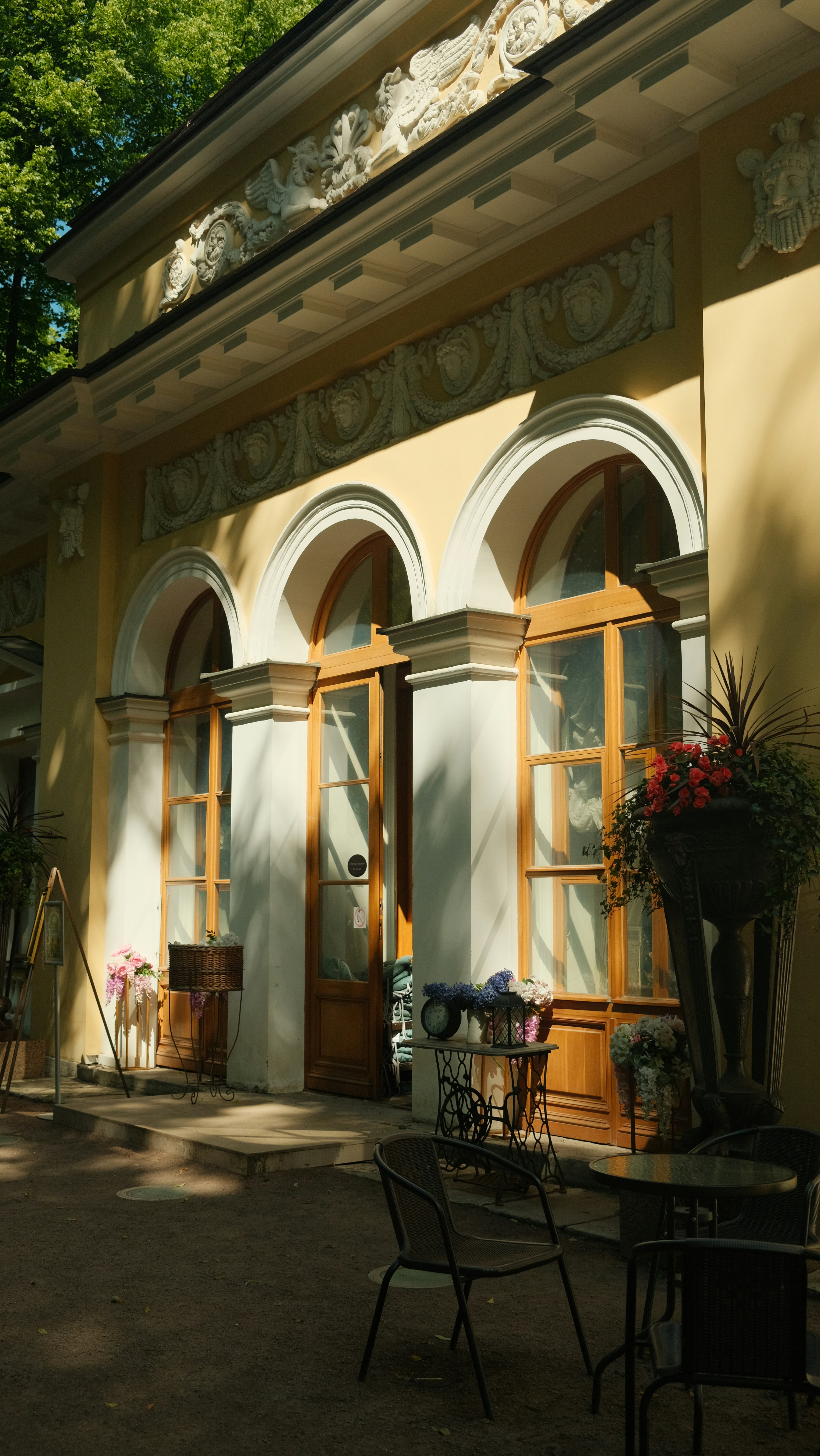 Sunlit Facade of a European Café-Garden Al Fresco