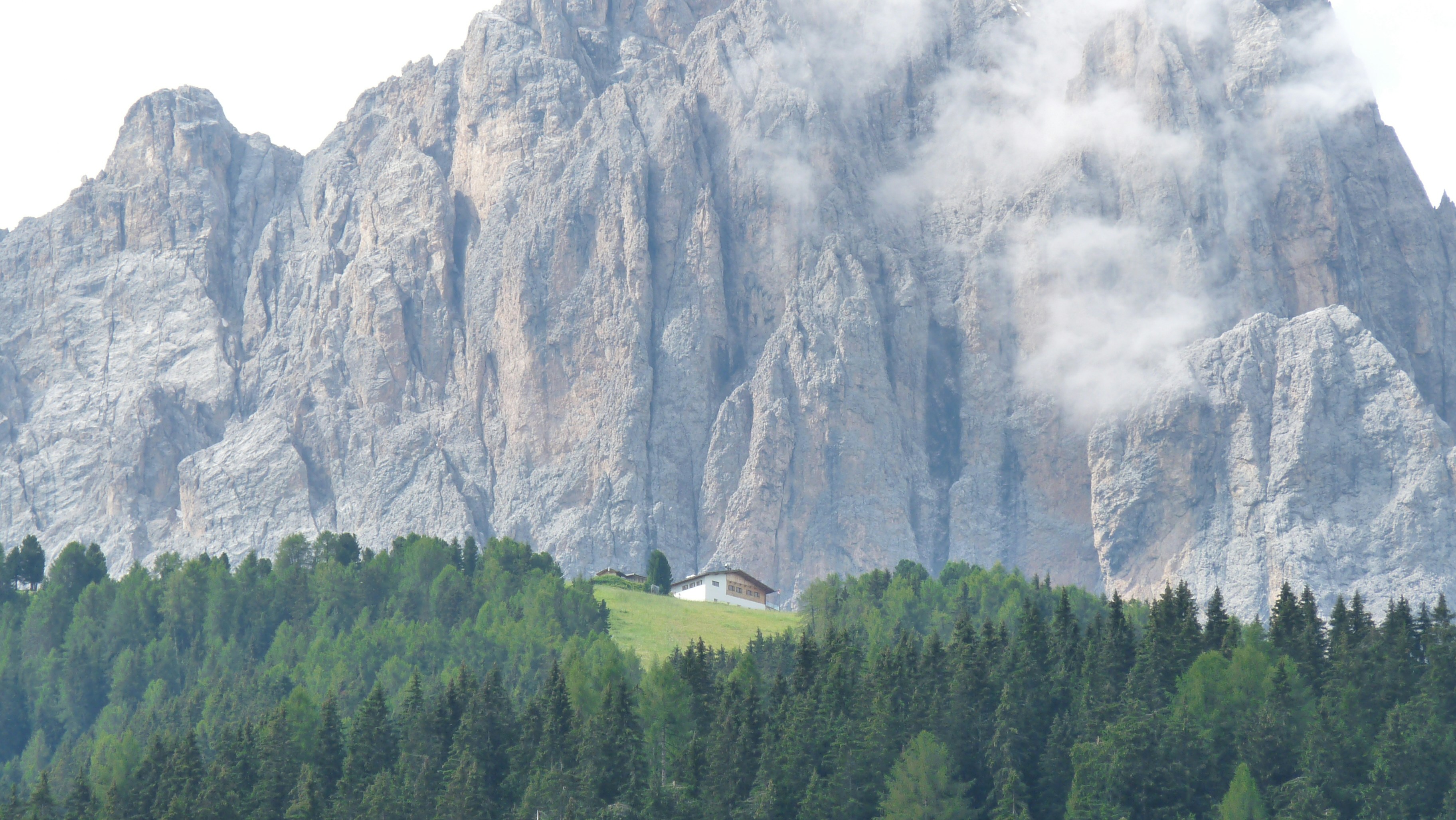 A Lone Chalet Nestled Along the Mountain Crest