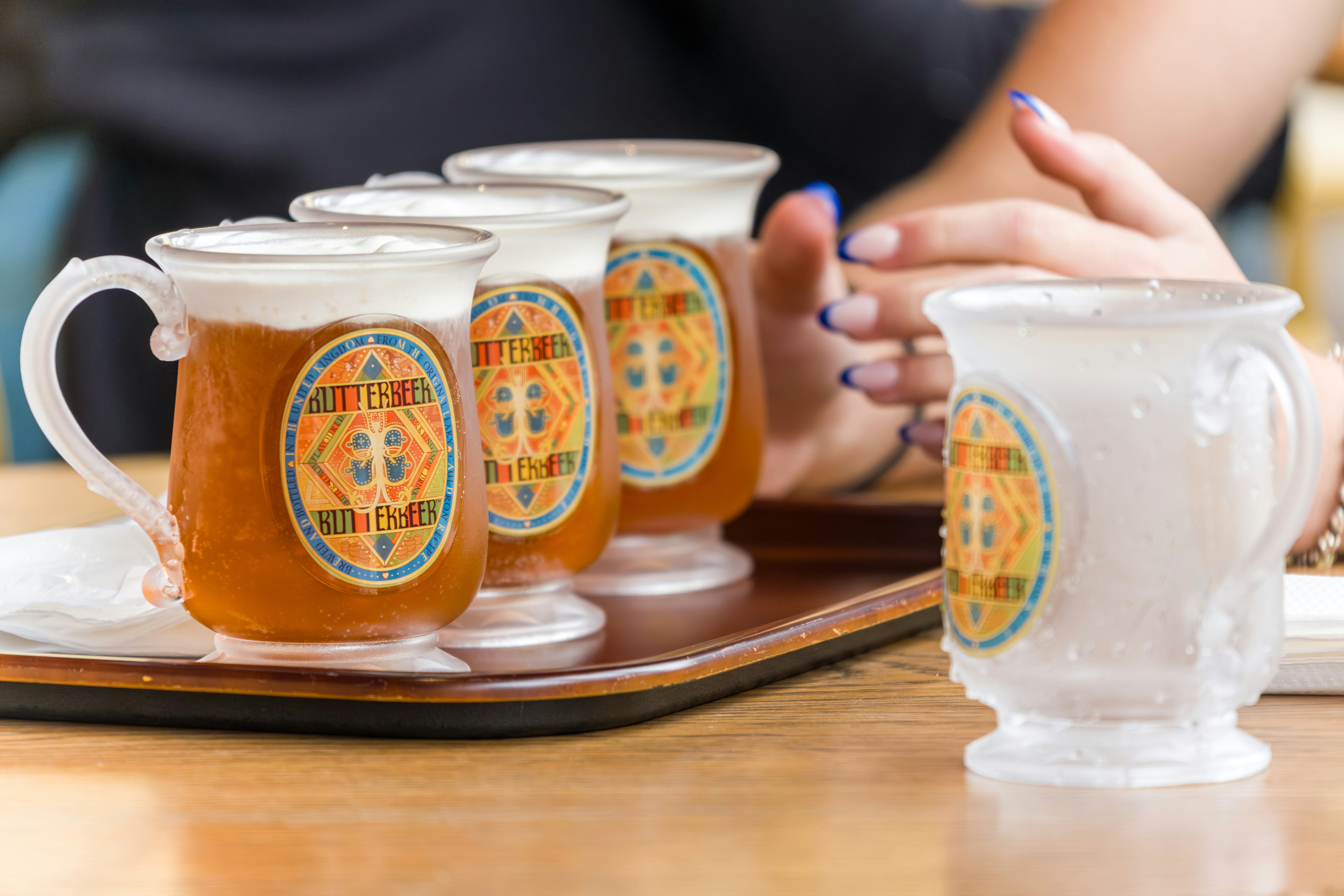 Amber Flight: A Row of Craft Beers on a Wooden Tray