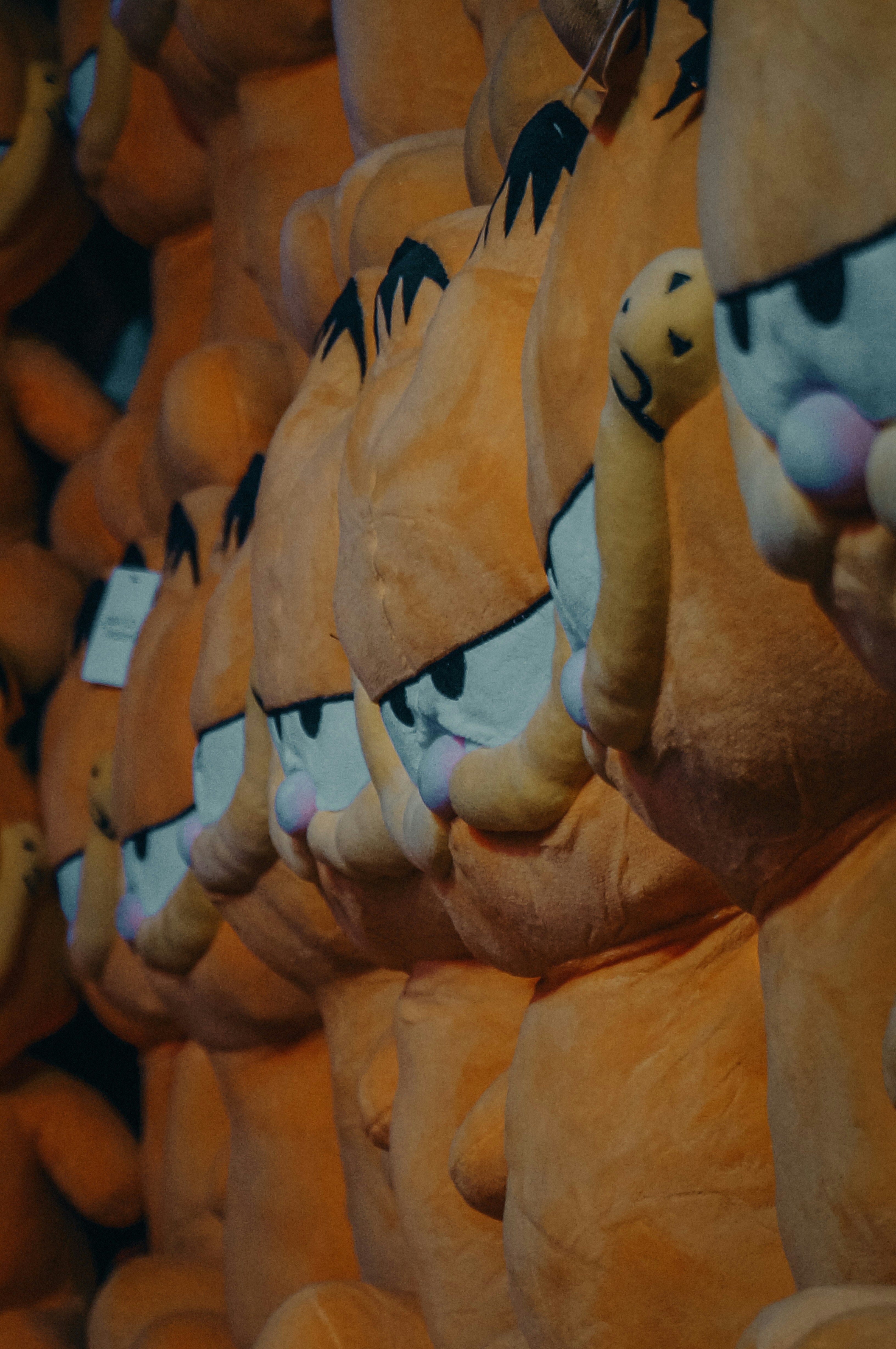 Orange plush parade: a tunnel of teddy bears in warm glow