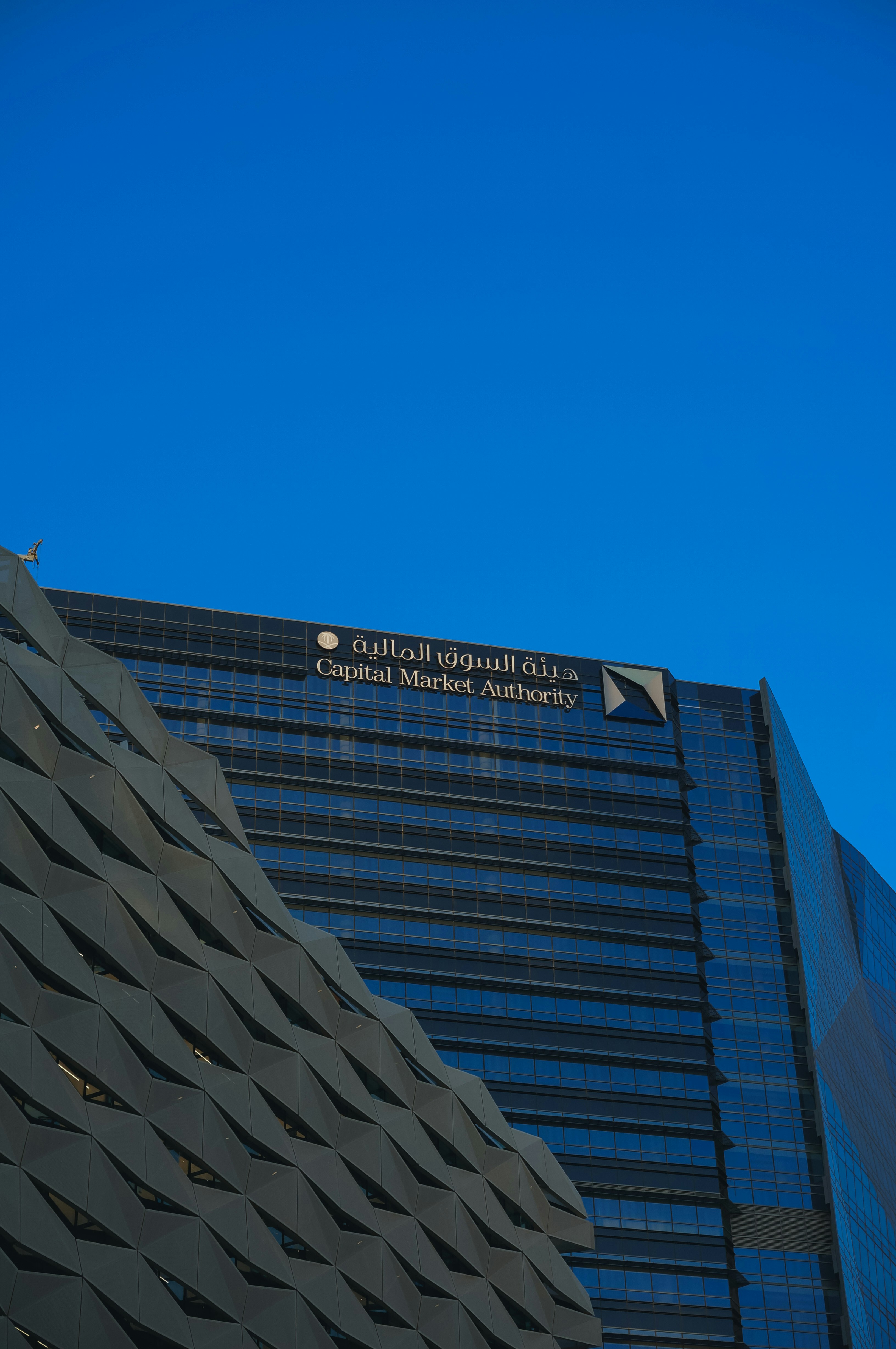 Glass Facade and Lattice Shadow at a Capital Market Authority Building