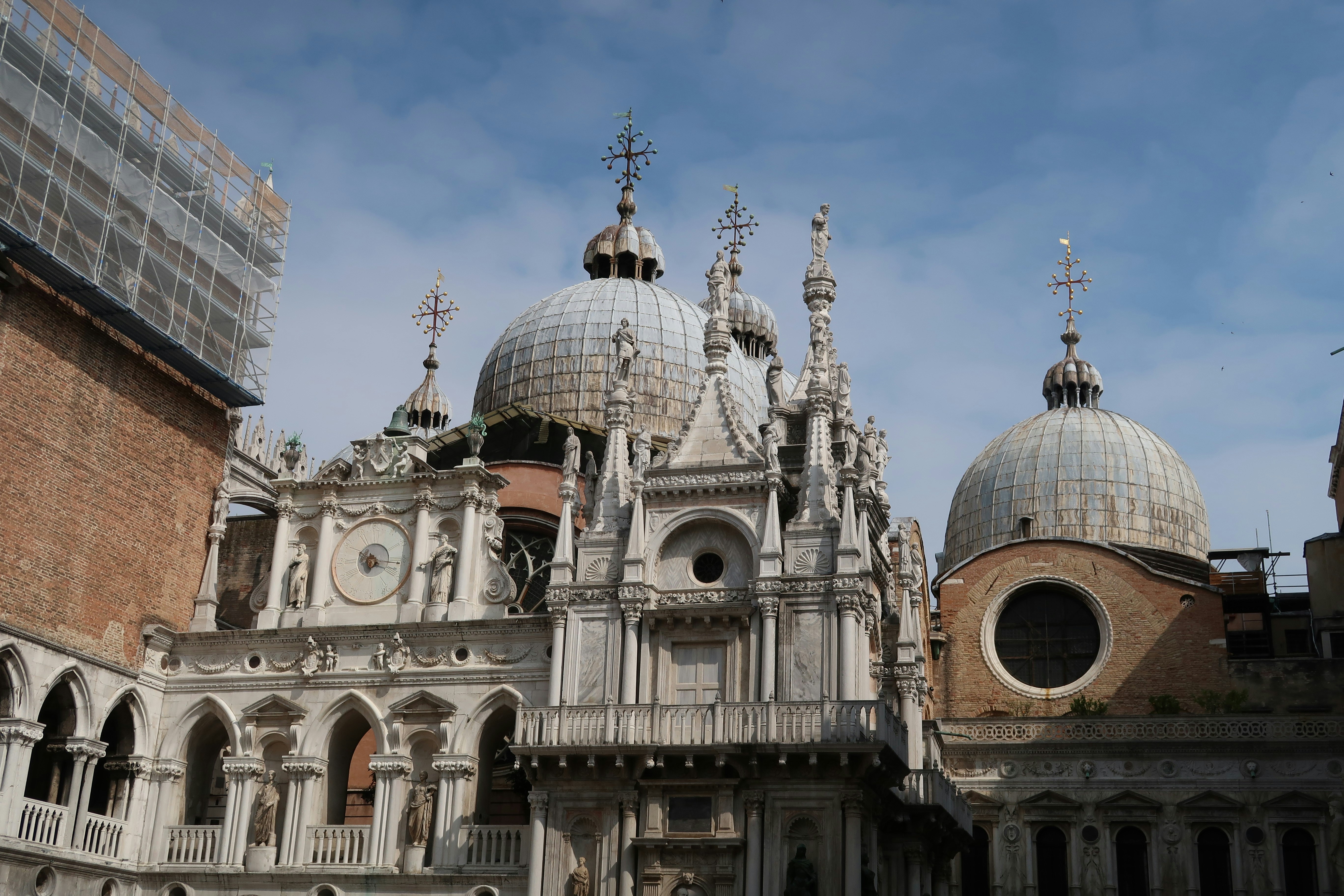 Ornate Venetian-Style Facade Rising Above Rooftops
