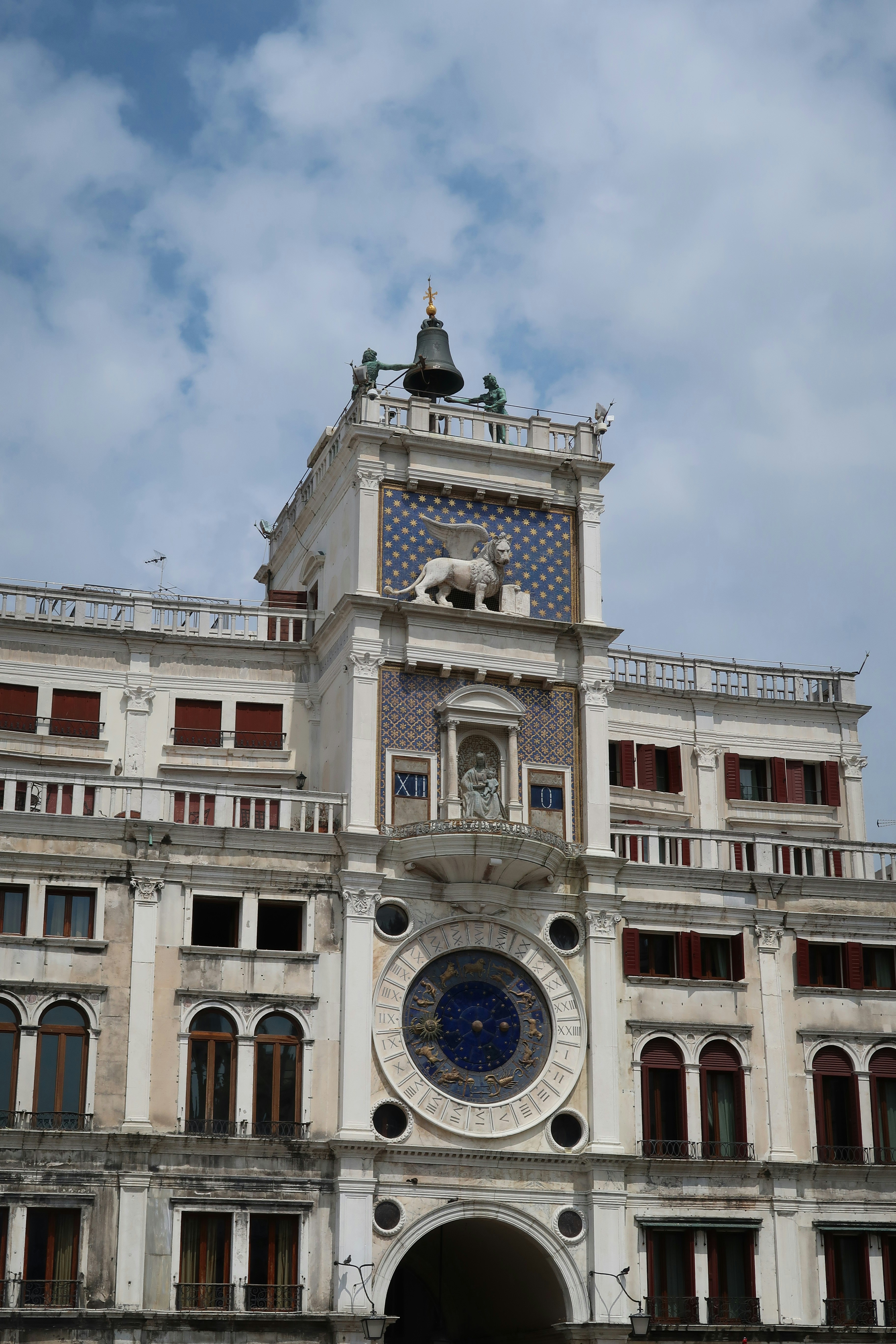 Clock Tower Triumph: A Venetian Facade with Ornate Astral Dial