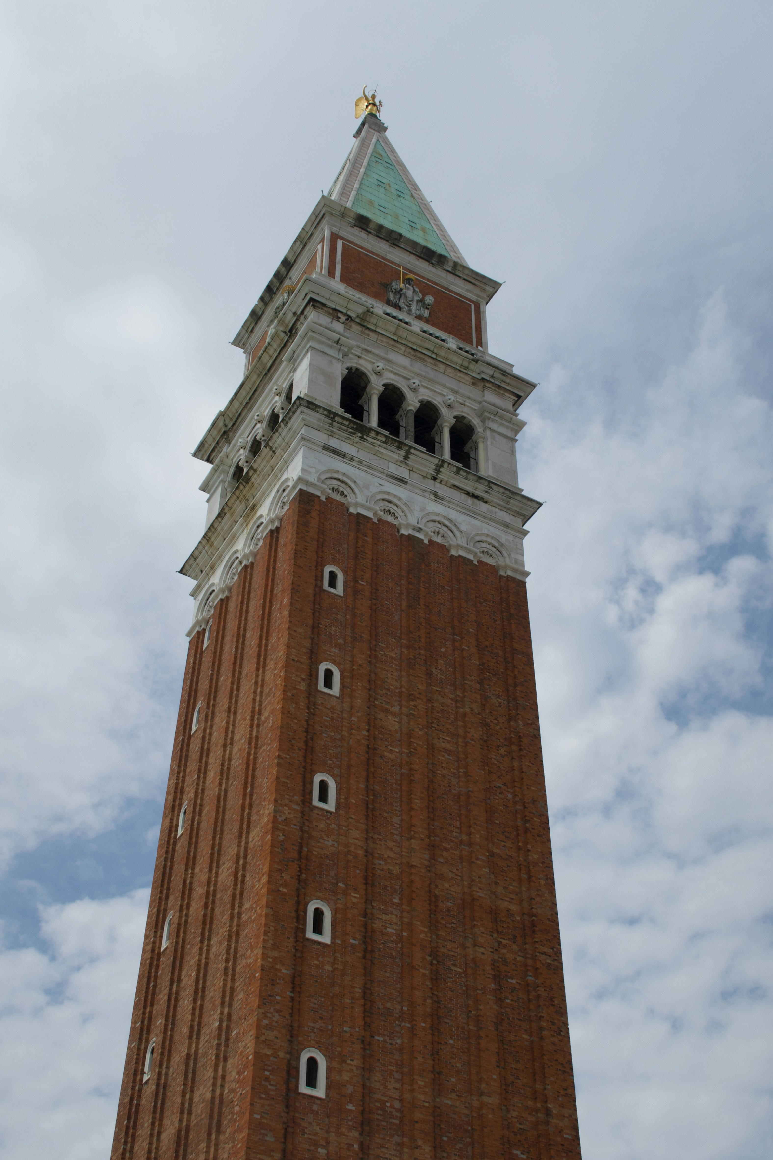 Rising Bell Tower: Crimson Brick and Sky