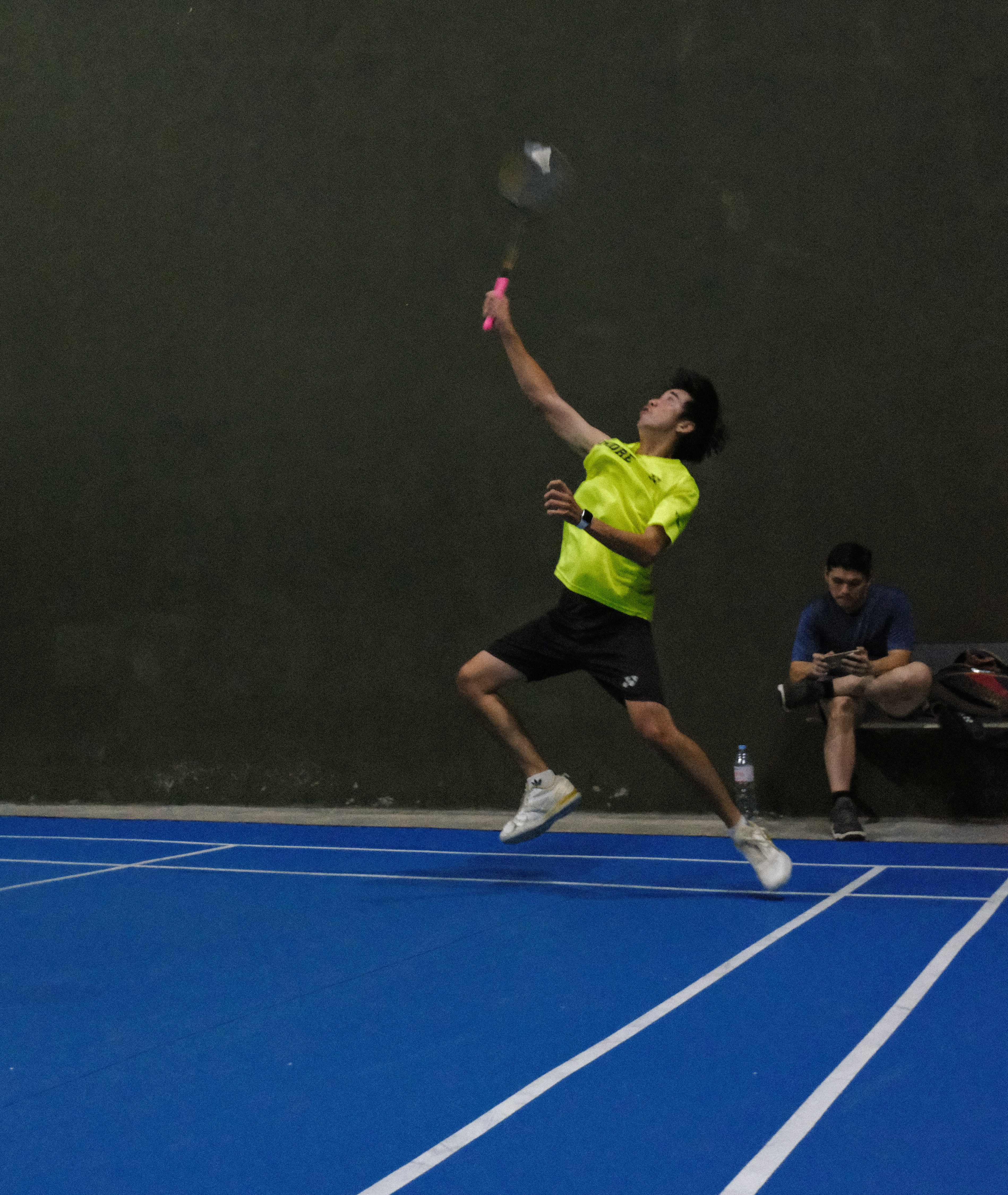 Lateral Leap: A badminton smash frozen in mid-air