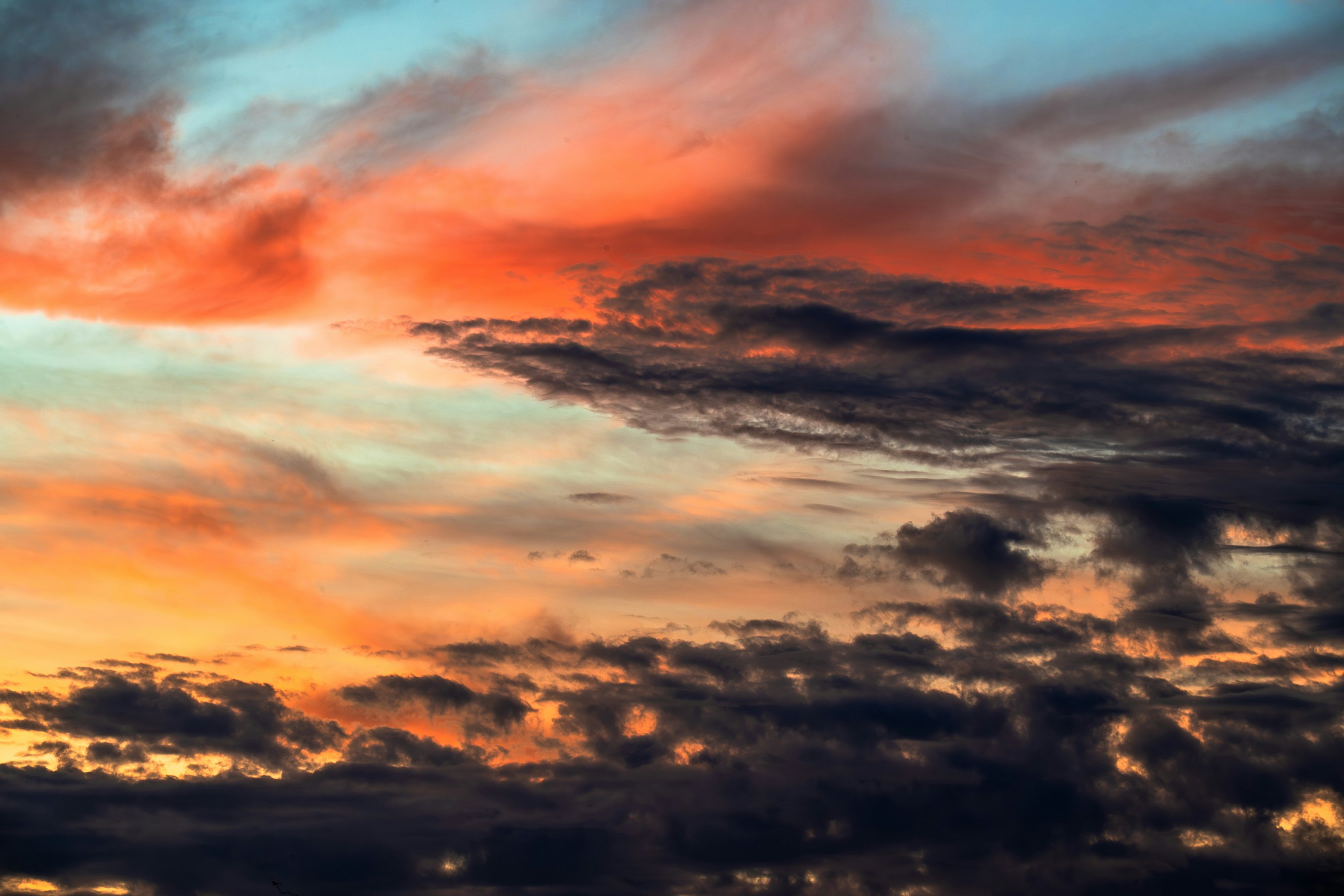 Fiery Crest: A Sky Ablaze with Sunset Clouds