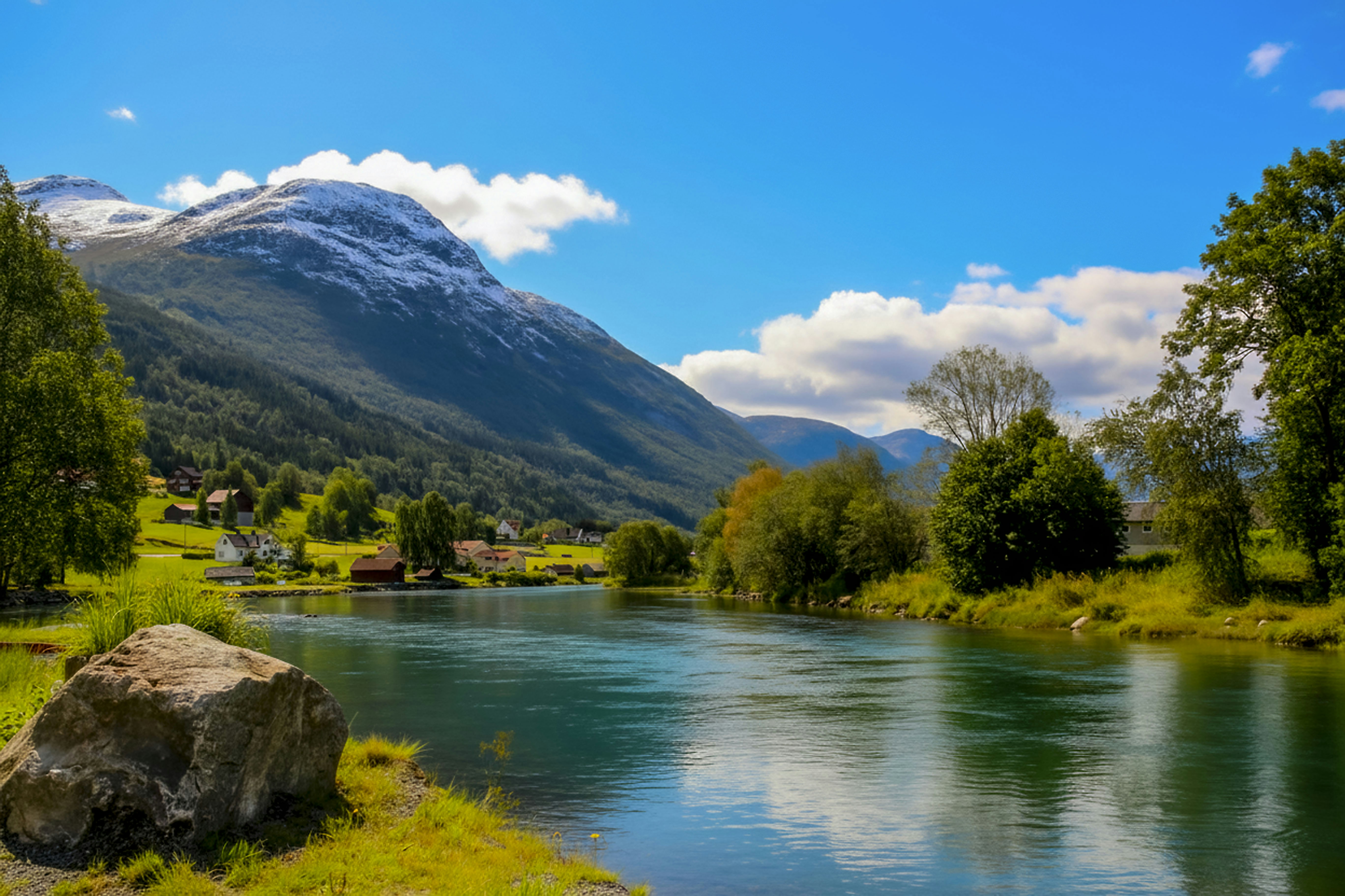 Glacial Blue Lake beneath a Sunlit Alpine Crest
