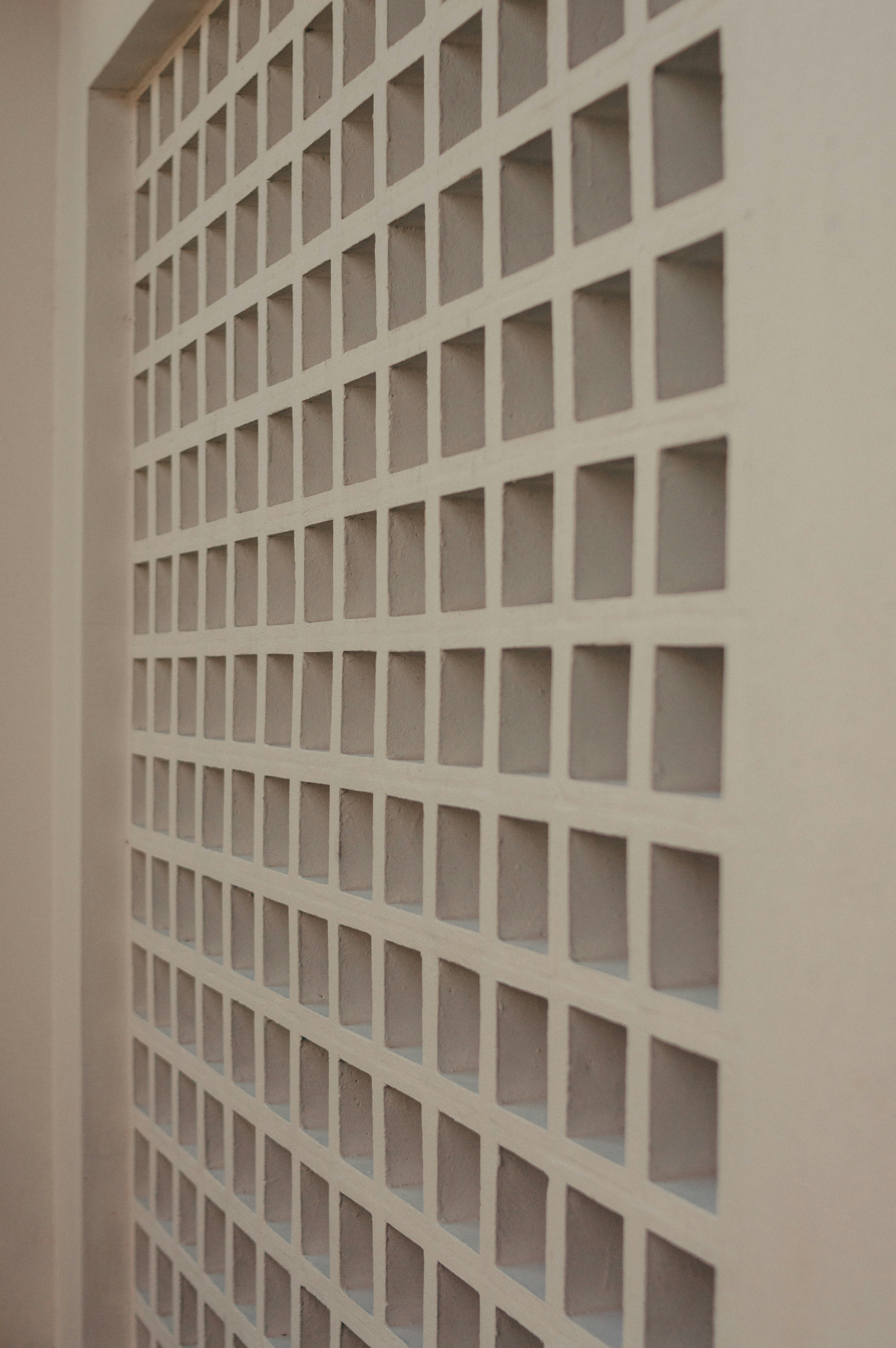 Grid of Light and Shadows: Repetition in a Concrete Panel Wall