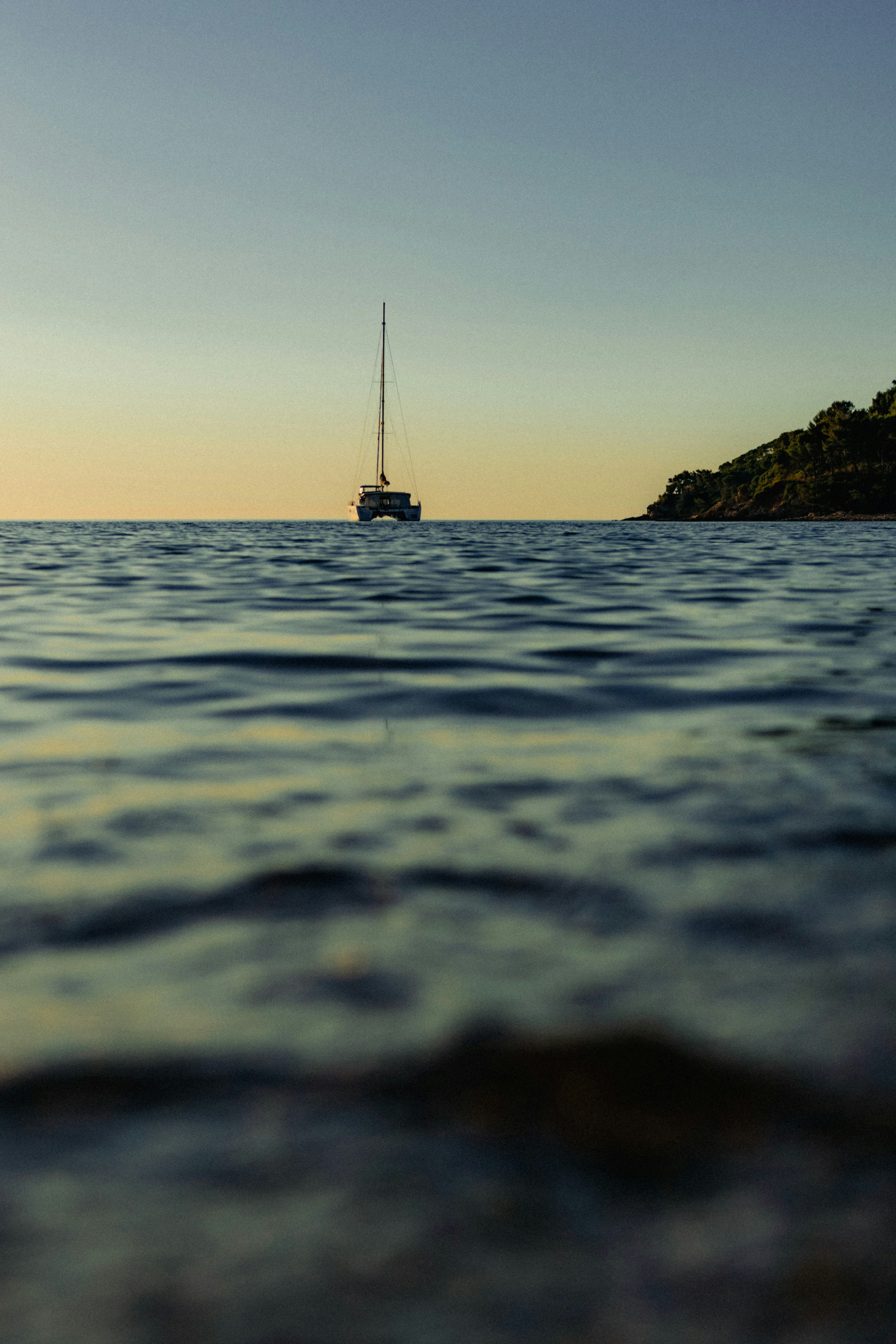 Sailboat Drift at Dusk: A Quiet Horizon