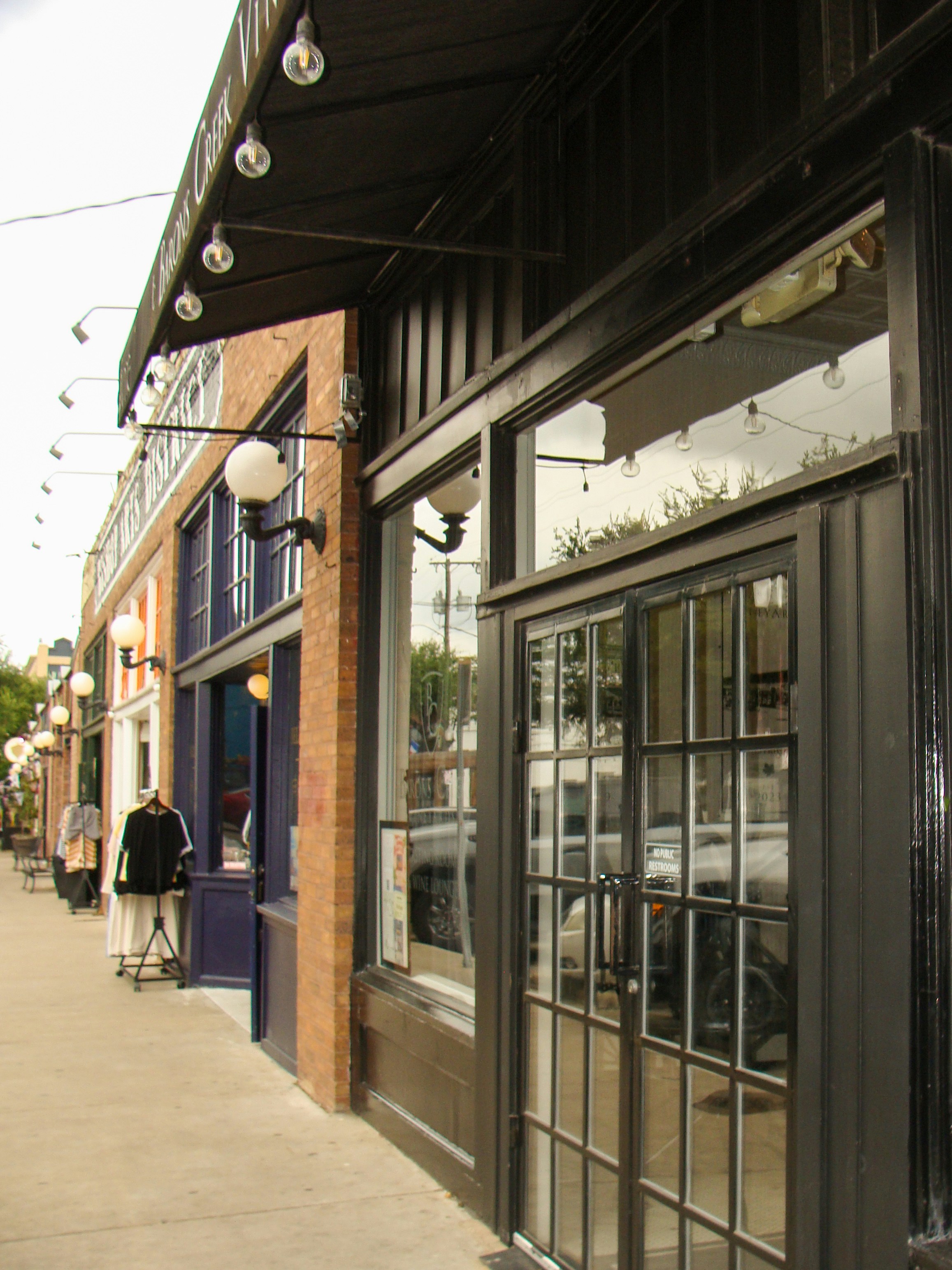  storefront promenade under string lights