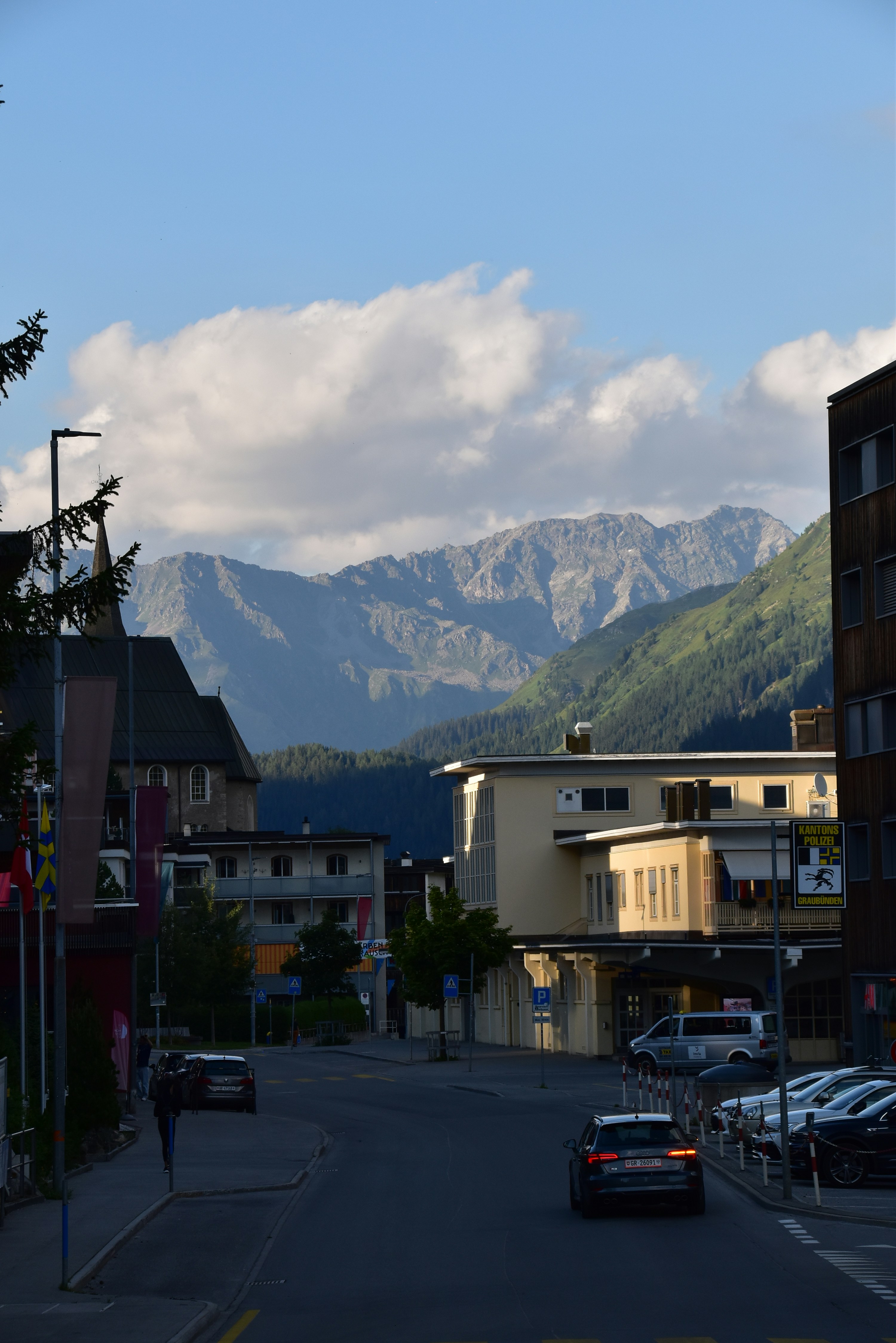 Mountain-town Street at Dusk: A Quiet Corridor to the Peaks