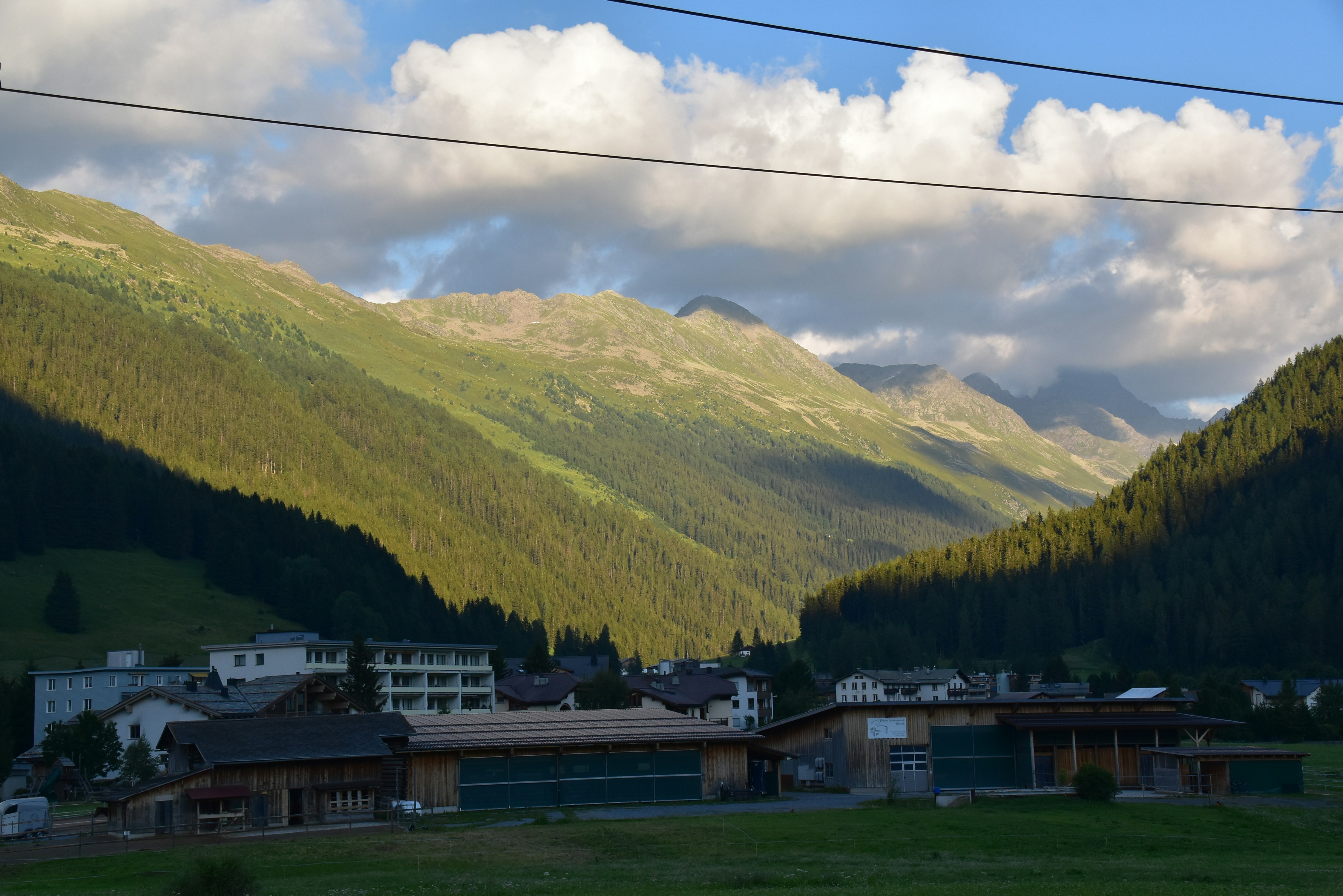 Village Edge Beneath Serene Alpine Light