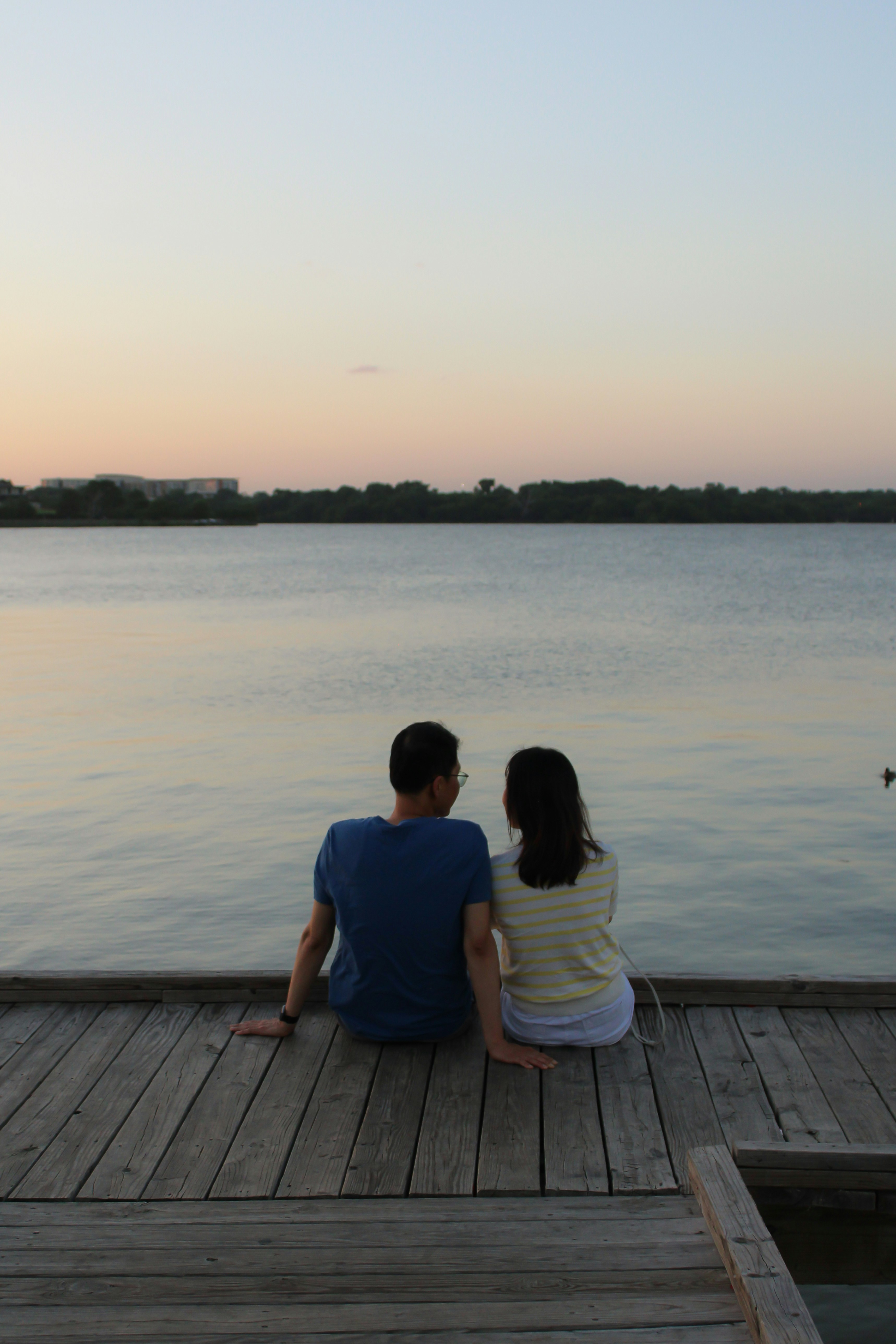 Sunset by the Pier: A Quiet Moment of Two on the Deck
