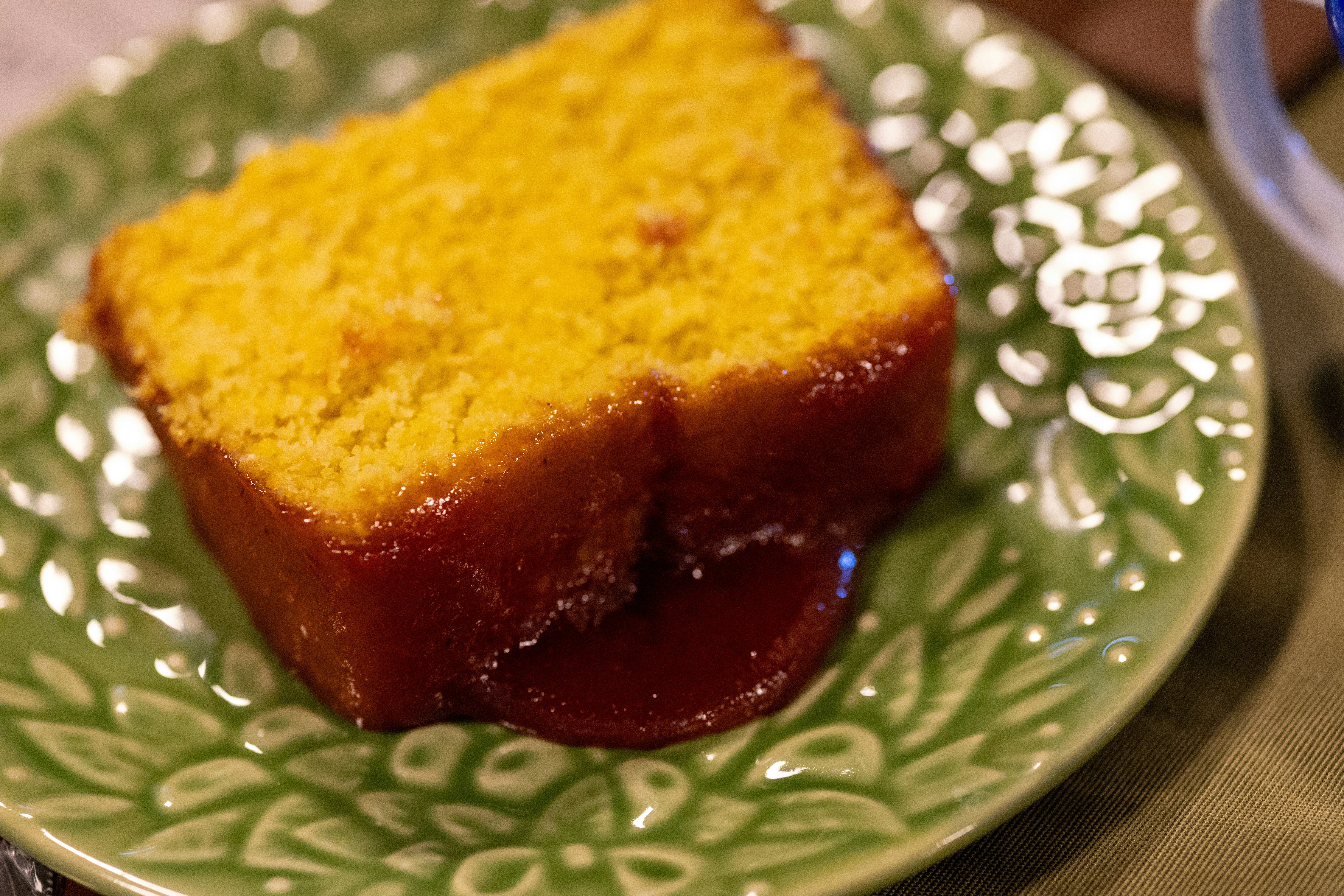 Sunlit Caramel Crown: A Slice on a Green Latticed Plate
