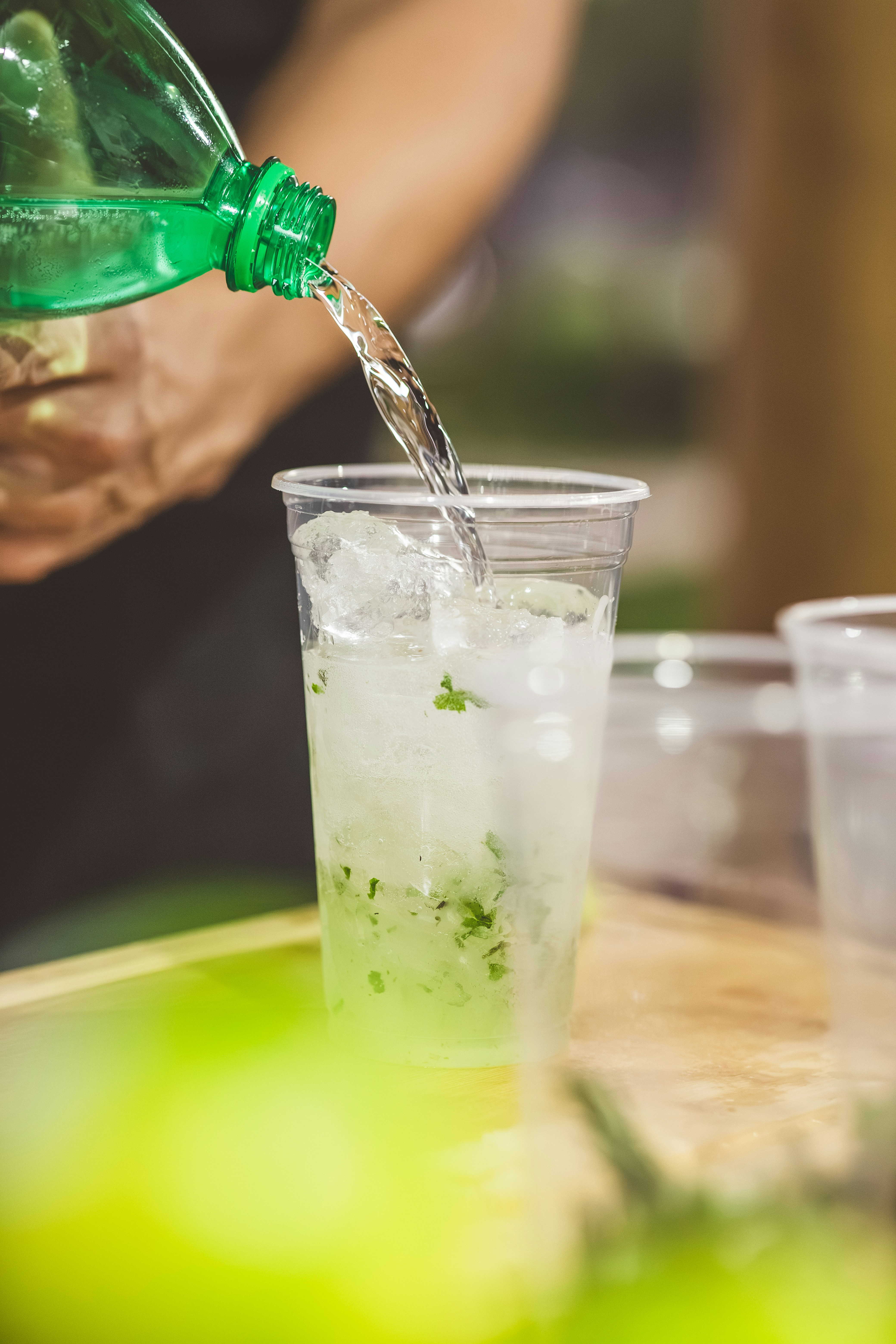 Green soda cascade: pouring clarity into a chilled glass