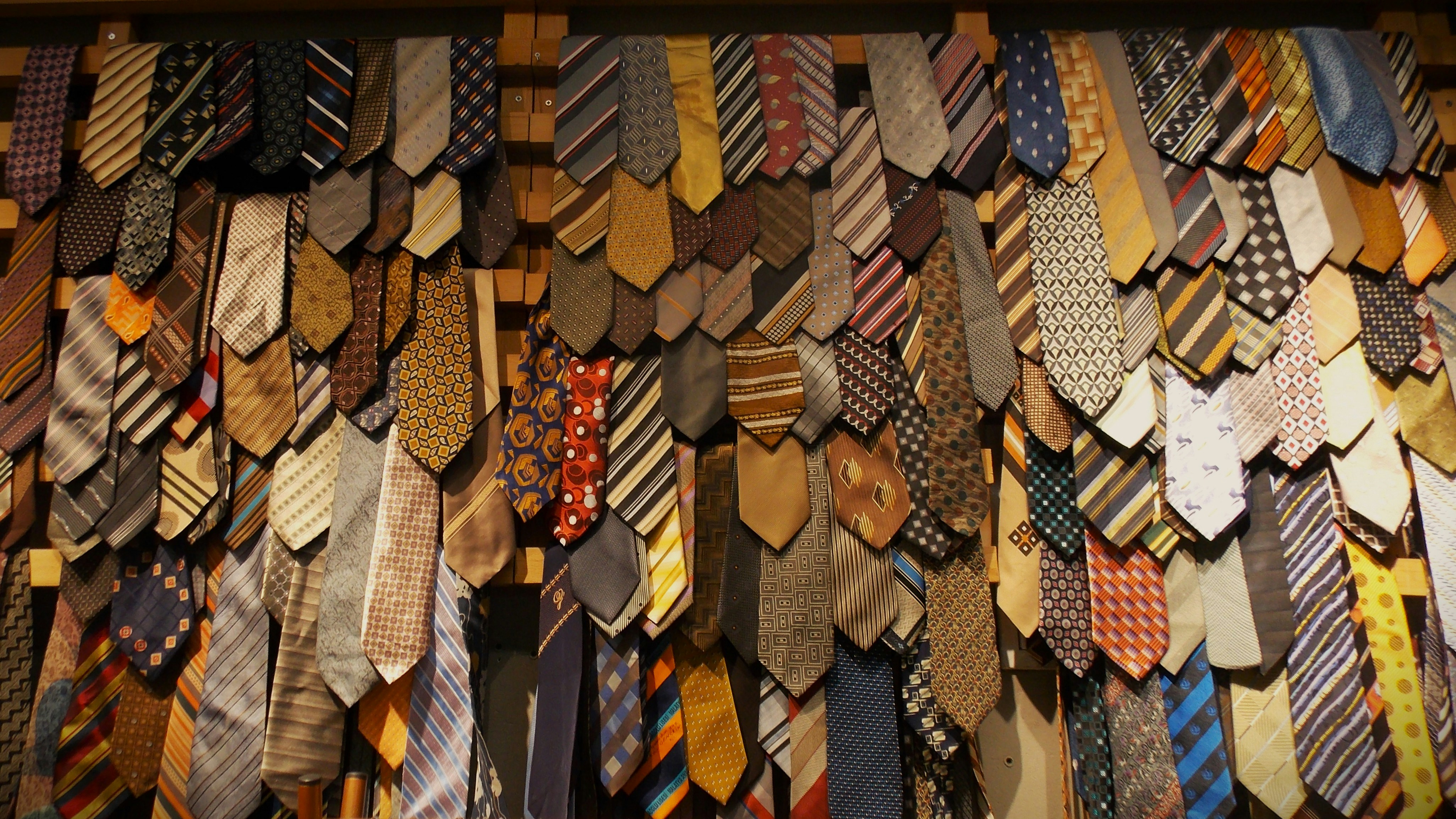 Dense Array of Neckties: A Tapestry of Pattern and Color