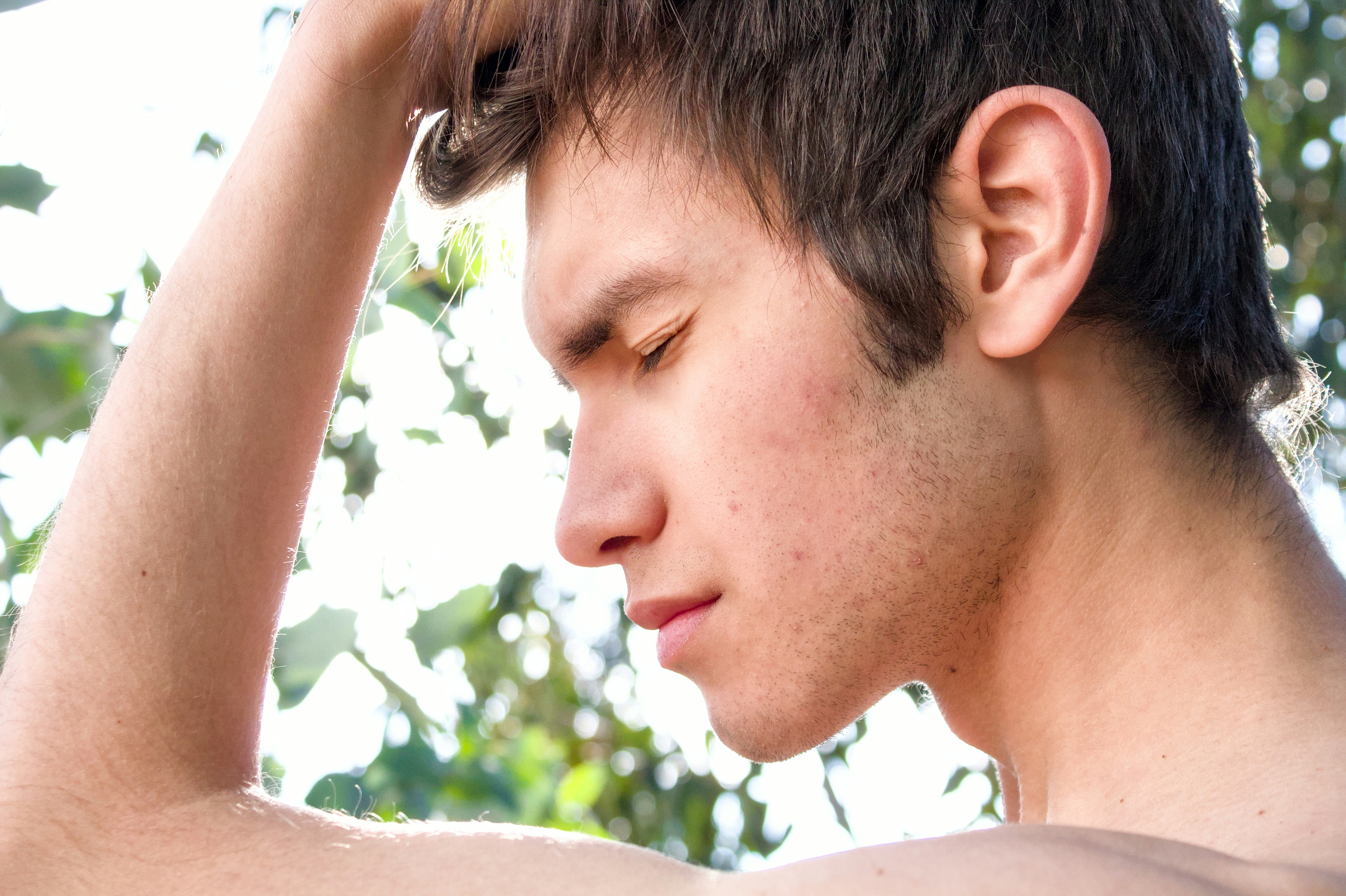 Profile in Soft Sunlight: A Contemplative Youth in Focus