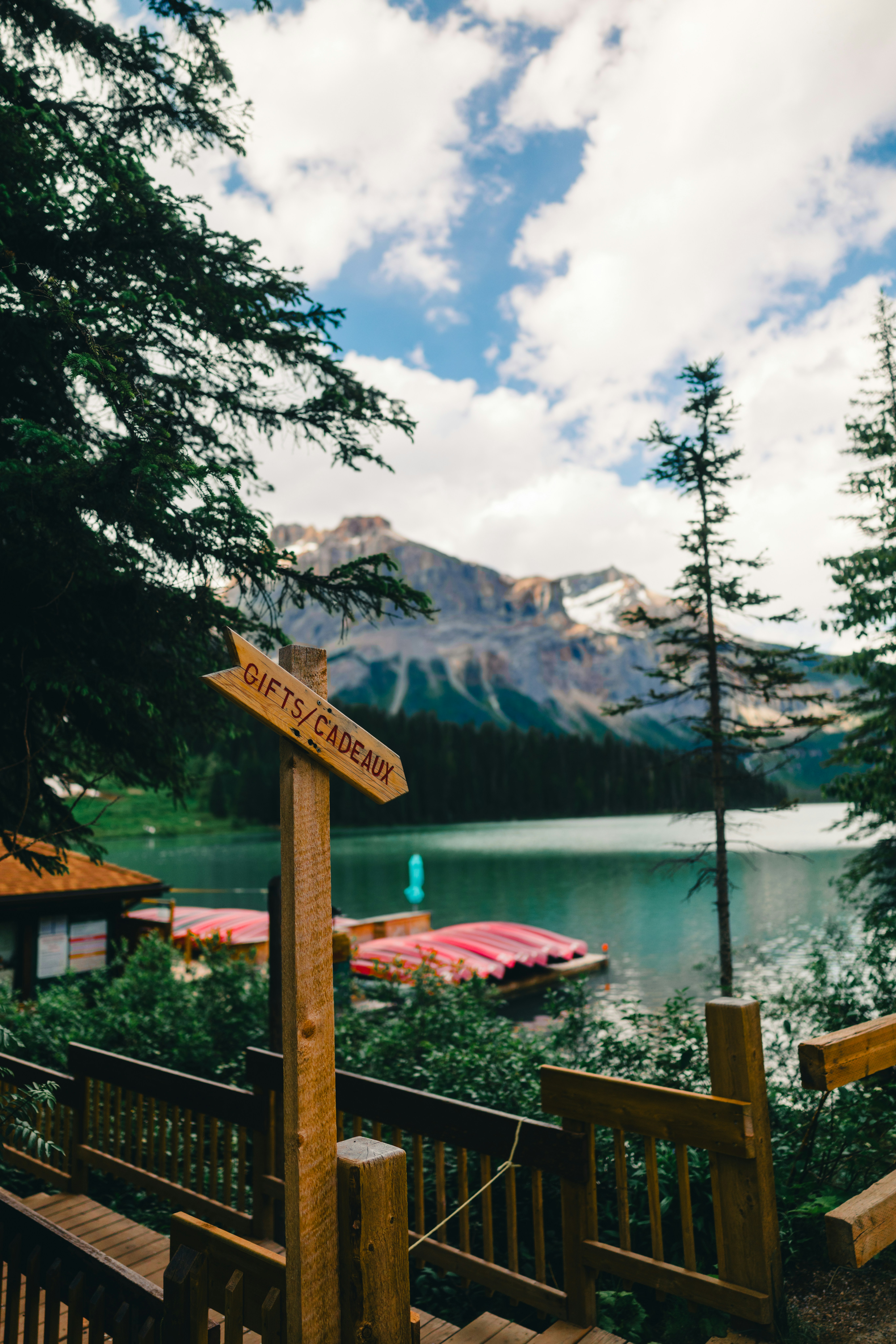 Signpost to Gifts and Cottages Overlooking a Mountain Lake