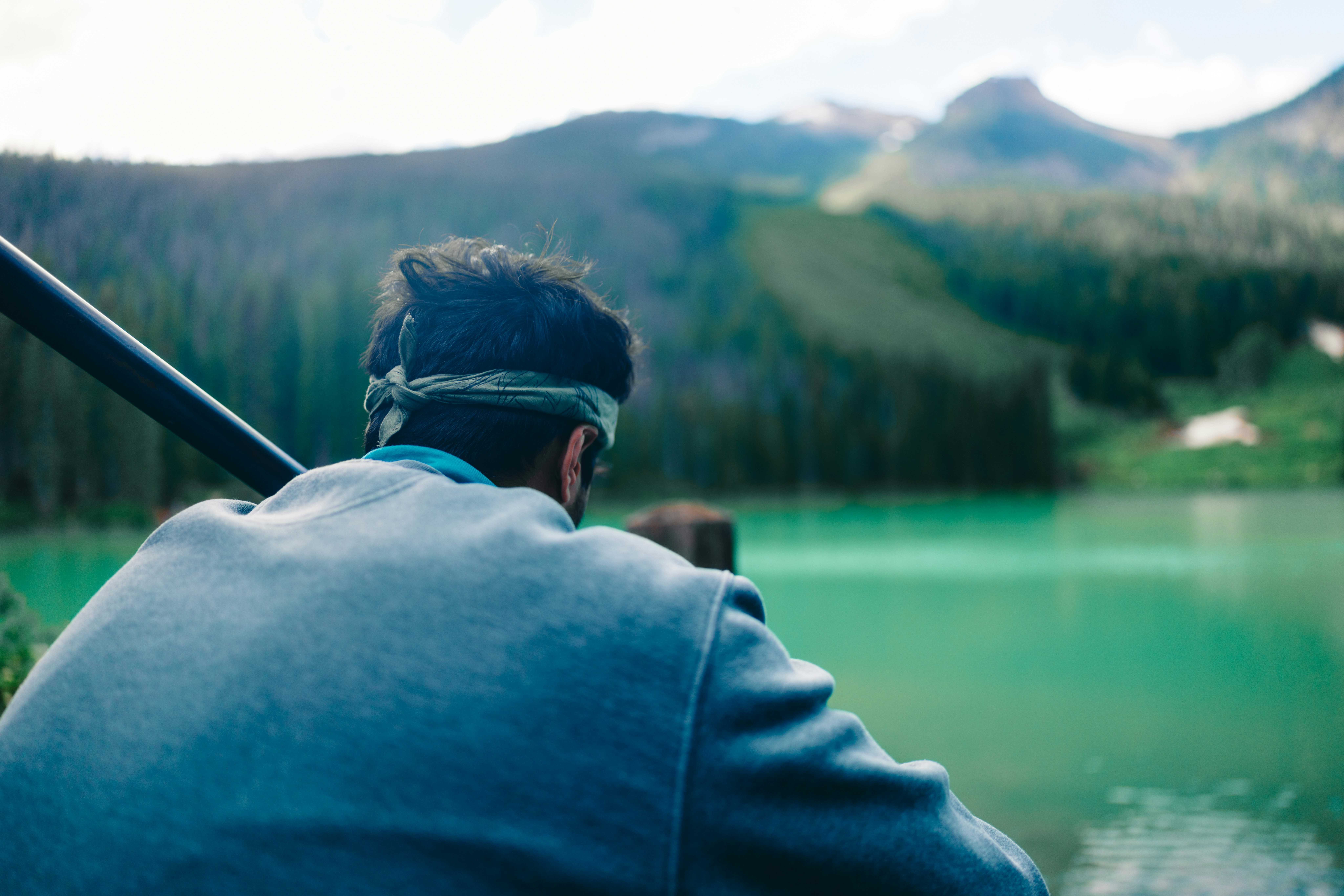 Over the Paddle: A Quiet Moment by the Mountain Lake