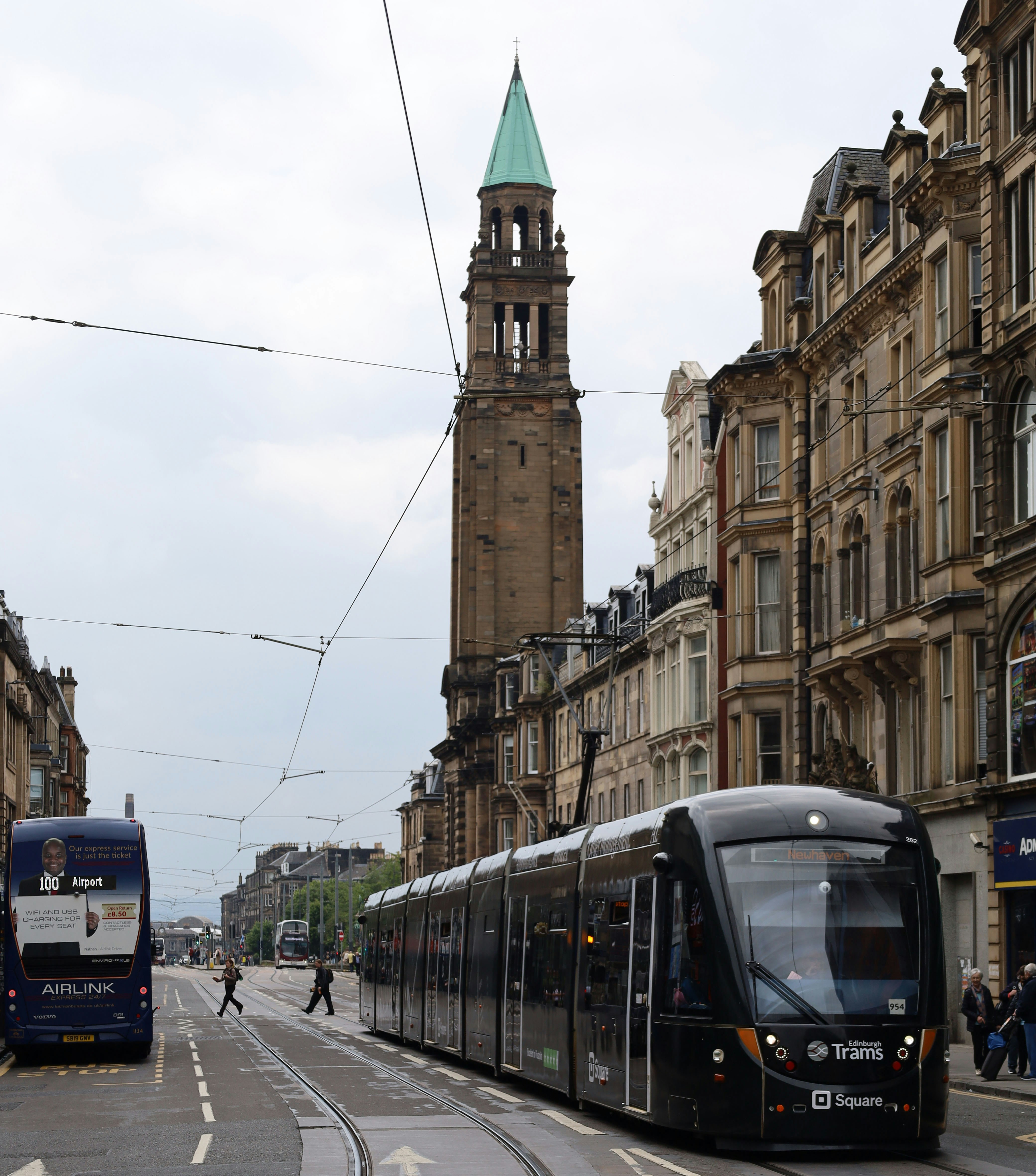 City Trams, Clock Tower, and Historic Facades