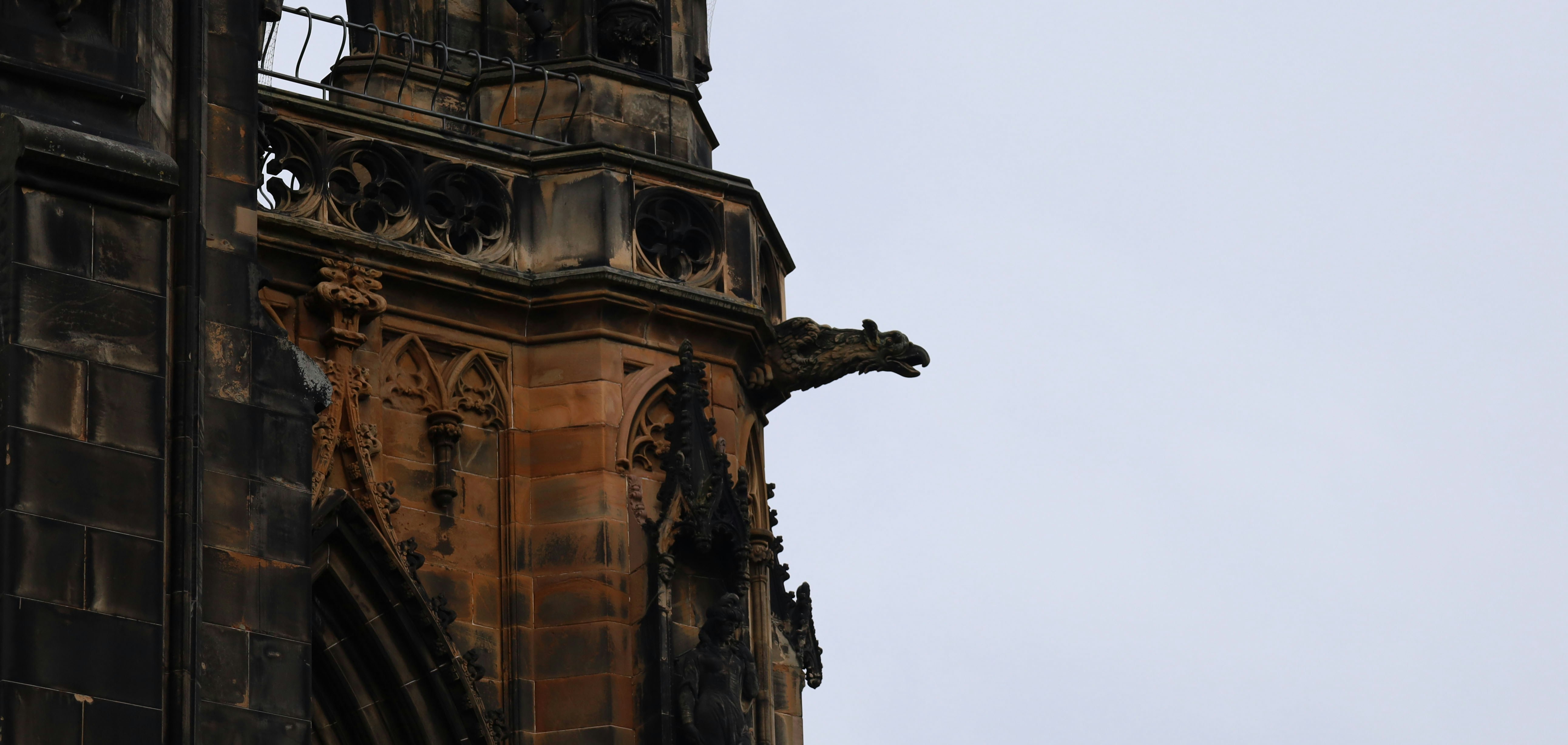 Stone Gargoyle Overlooks the City Edges