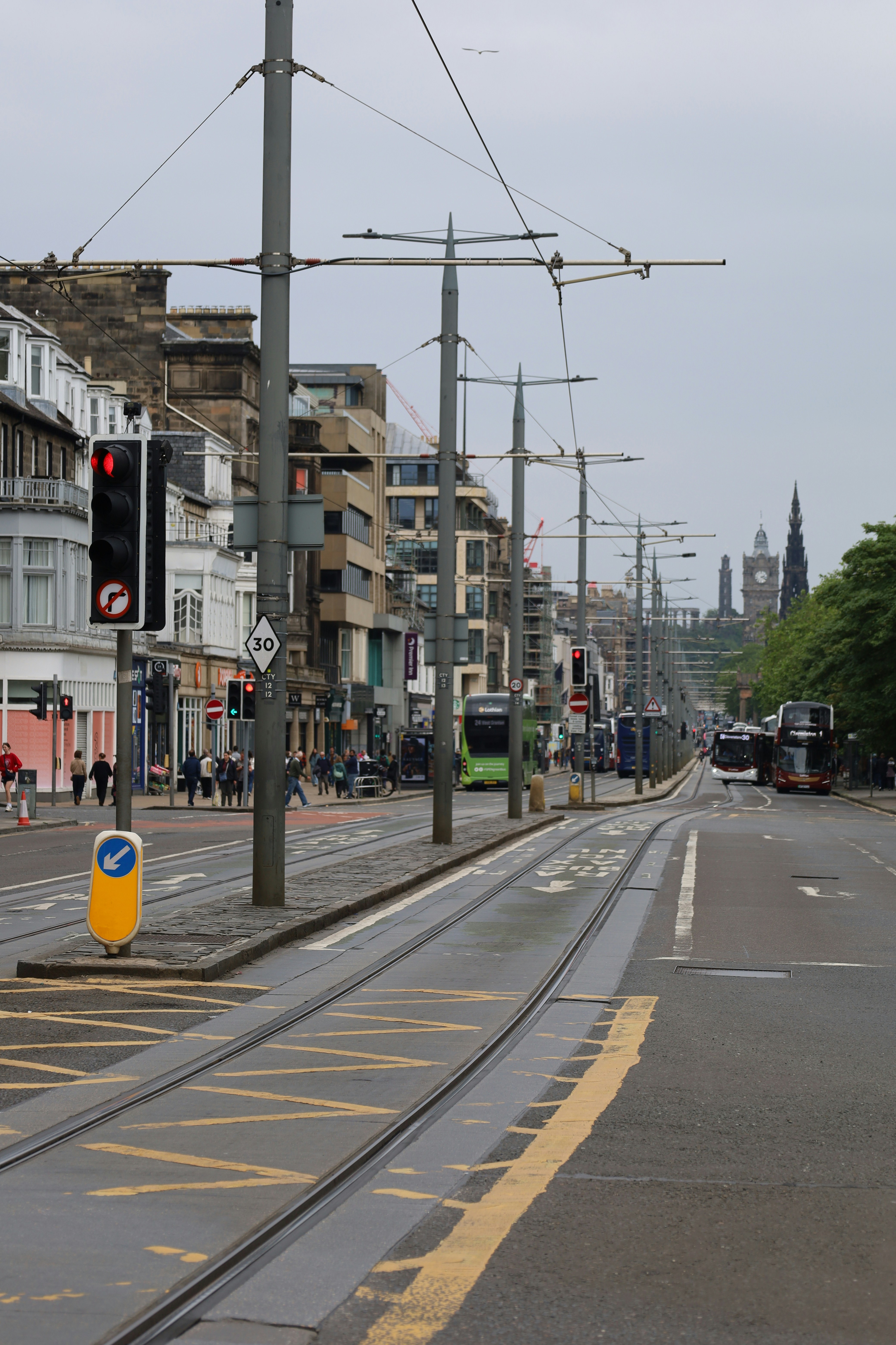 Urban Tramway Lines Converge Beneath Overcast Skyline