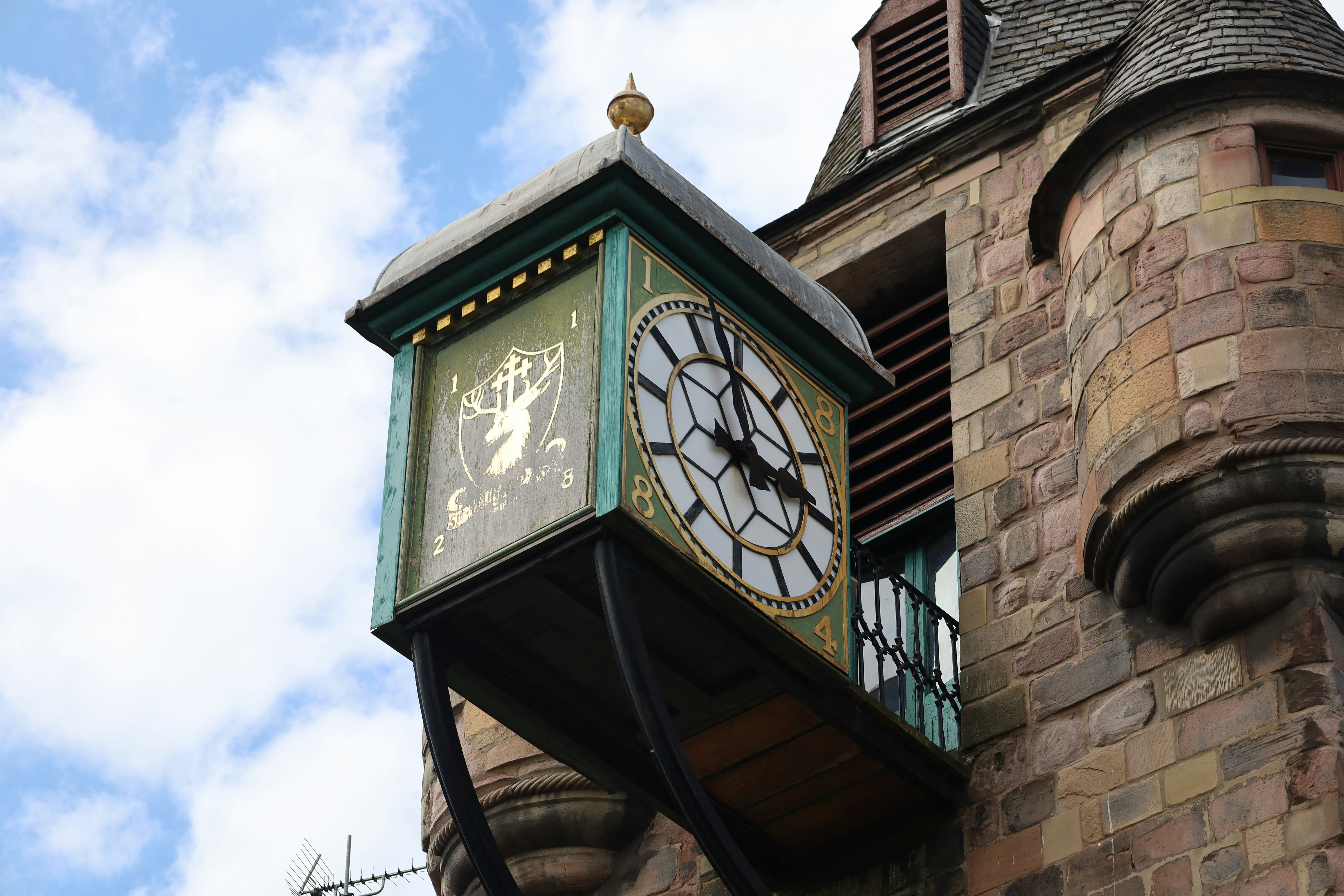 Clock Tower Overlooking The City: A Stone Sentinel