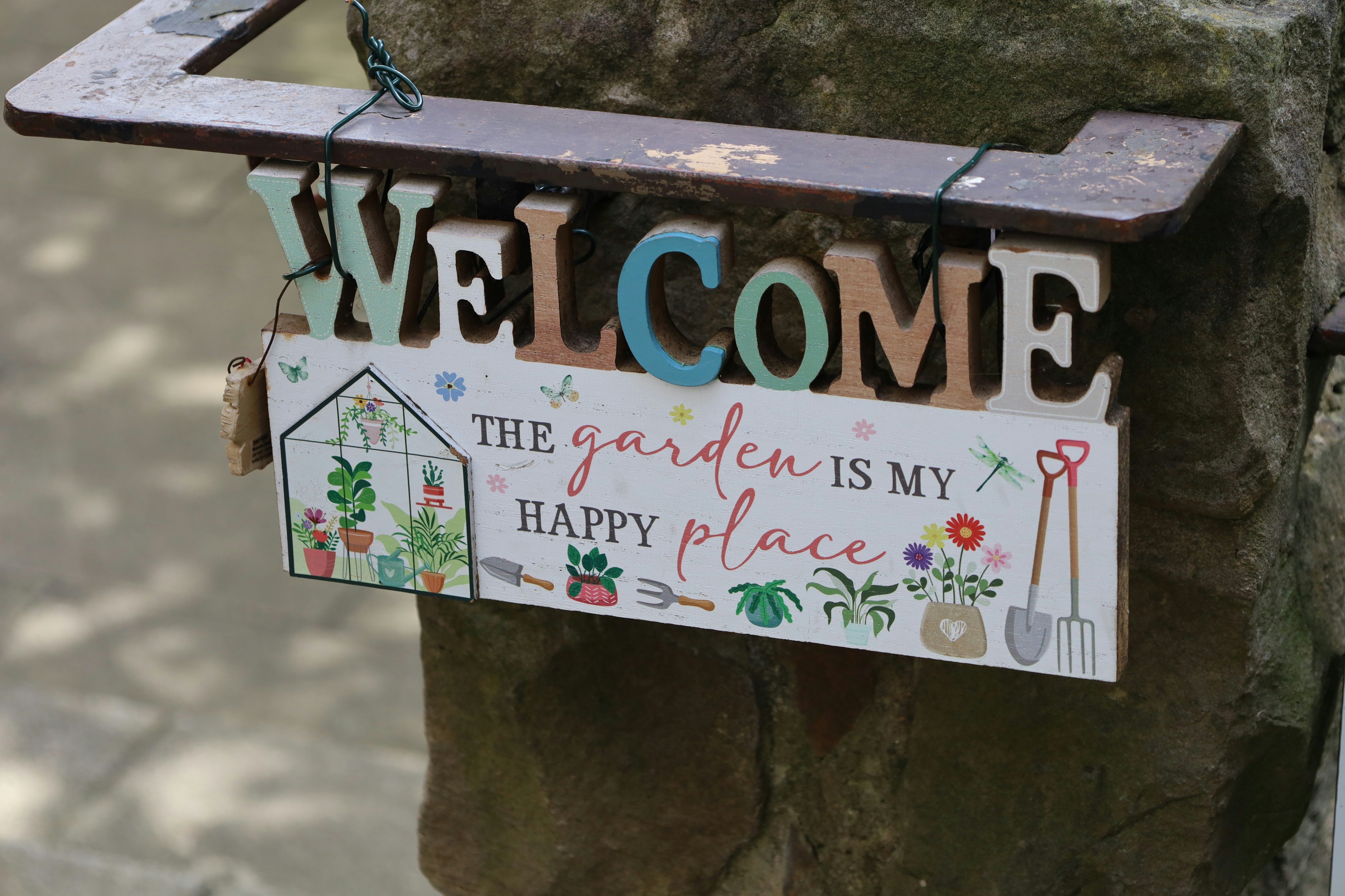 Welcome sign with gardening theme and 'happy place' text.