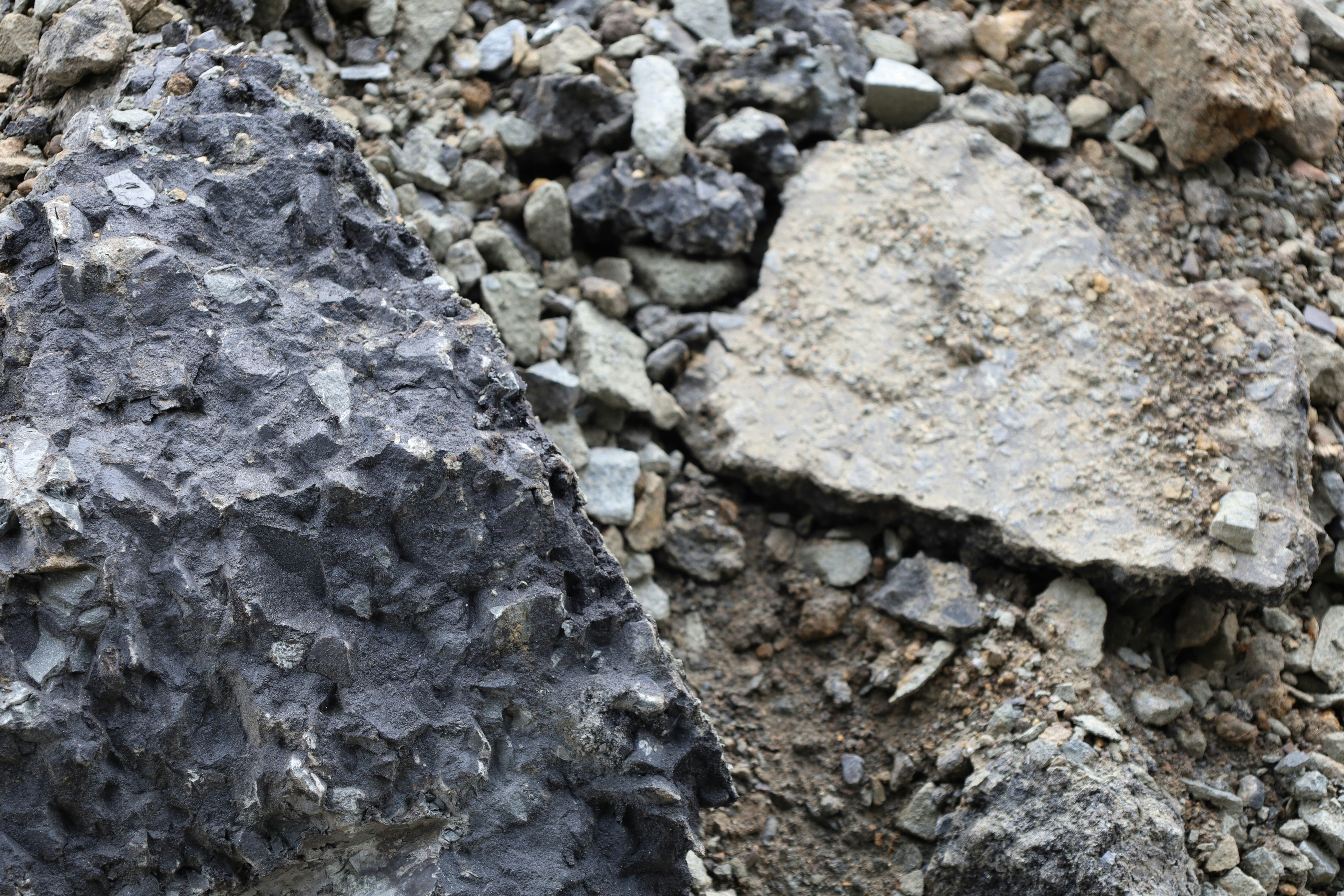Fragmented Ground: A Close-Up of Rough Rock and Sand Grains