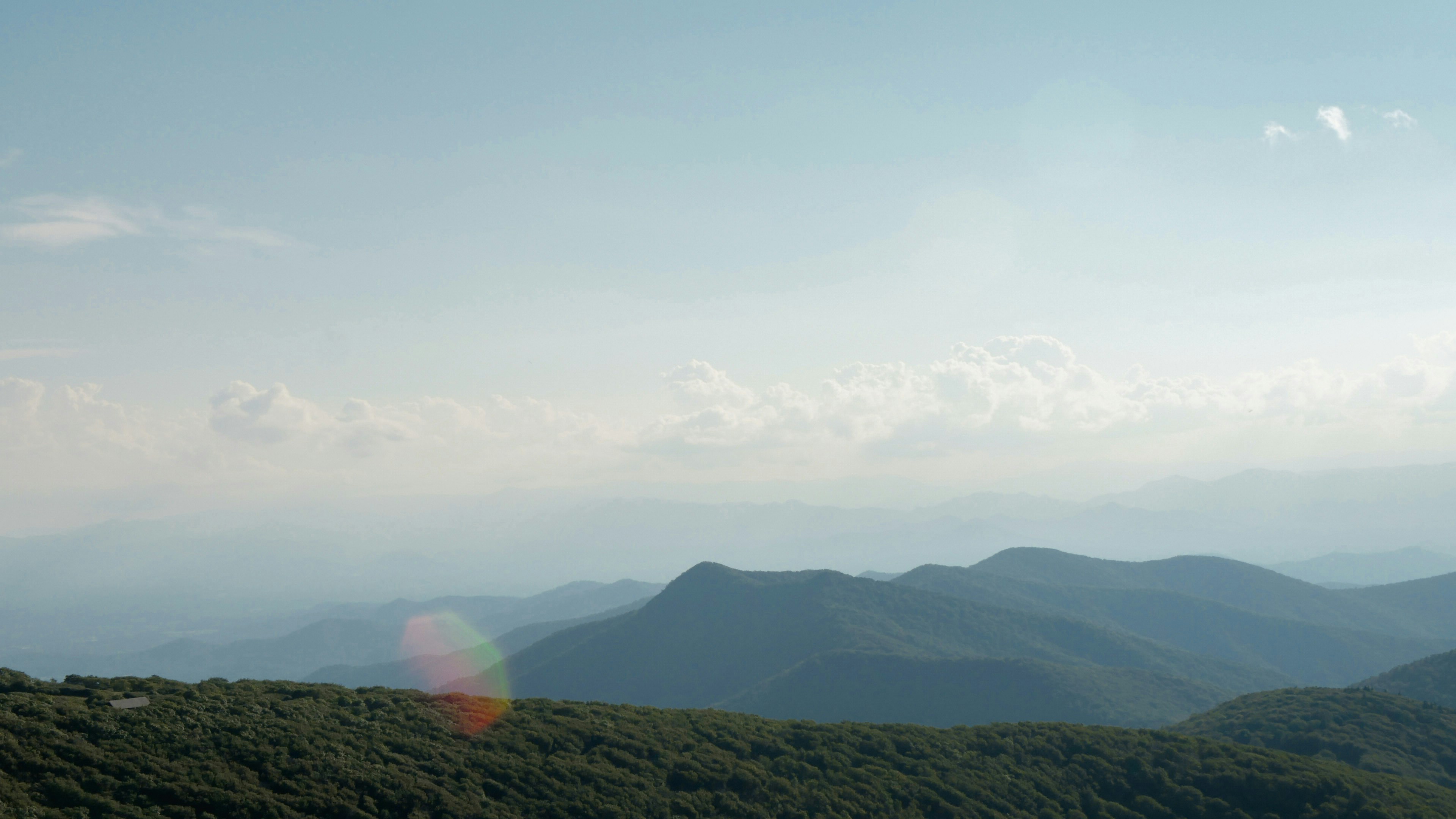 Mist-Wedged Ridge: Quiet Horizon Over Layered Mountains