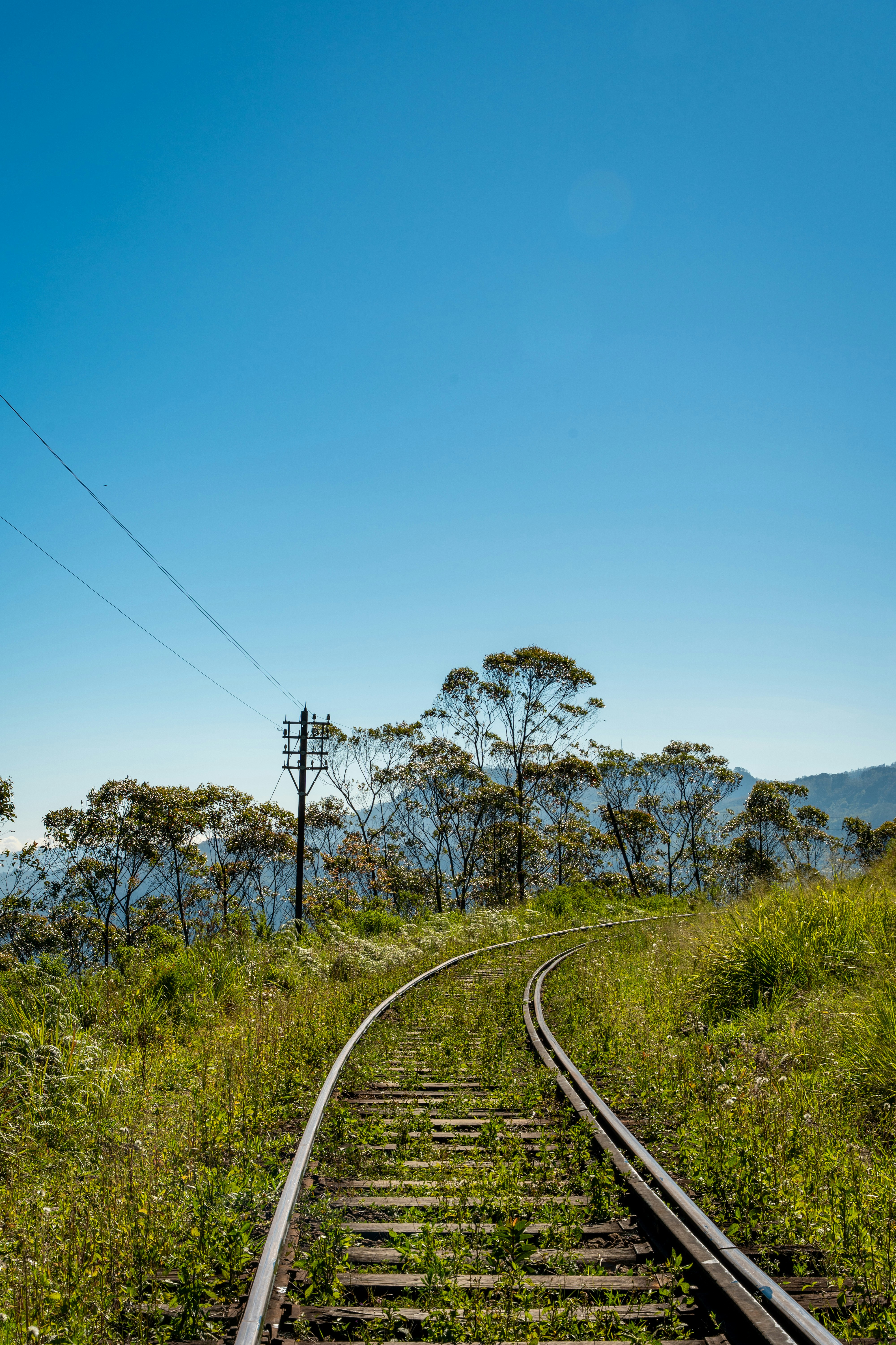 Rugged Tracks and Blue Sky Above: A Quiet Climb Toward the Horizon