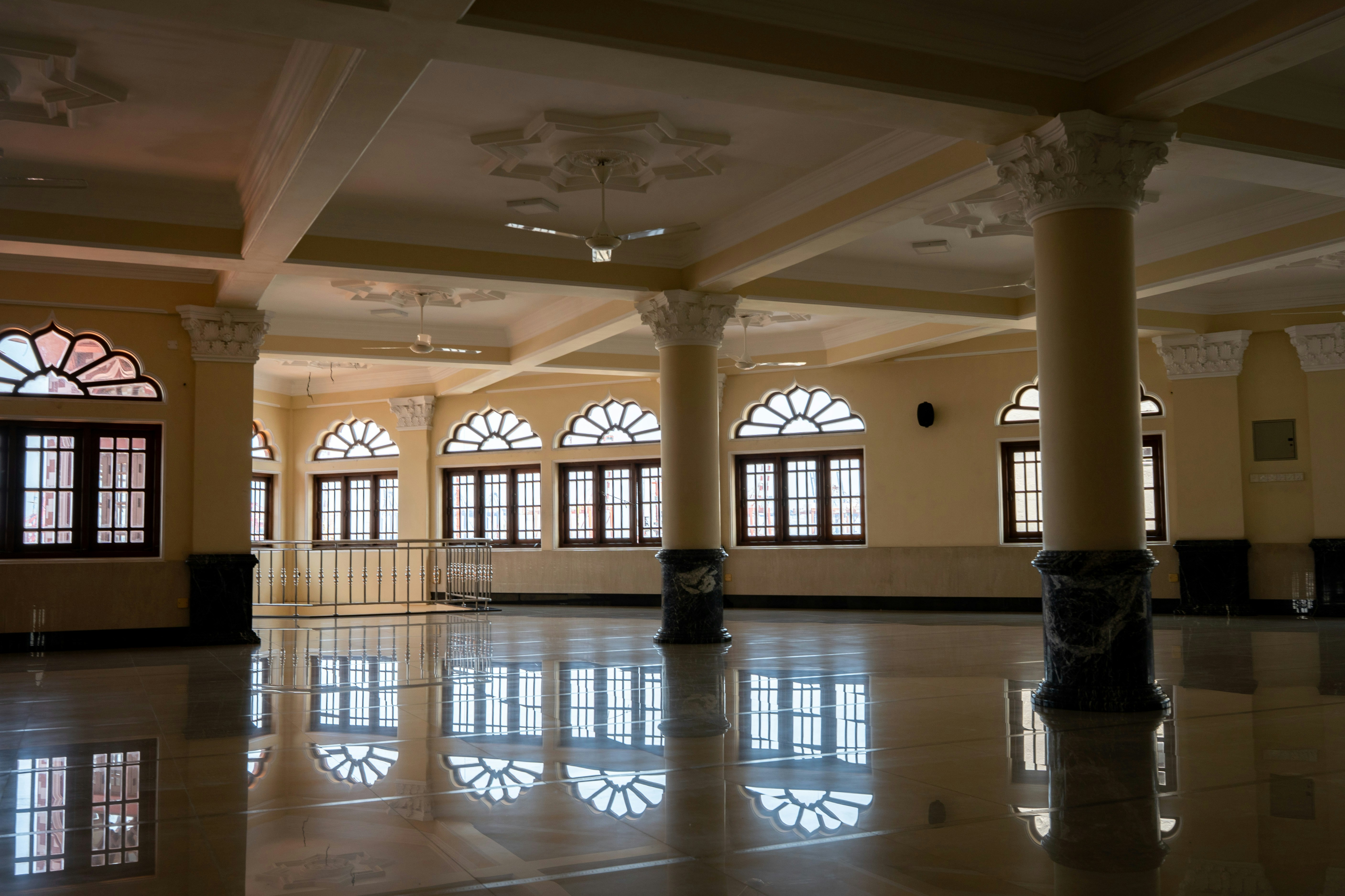 Echoes of Marble: Sunlit Columns in a Quiet Grand Hall