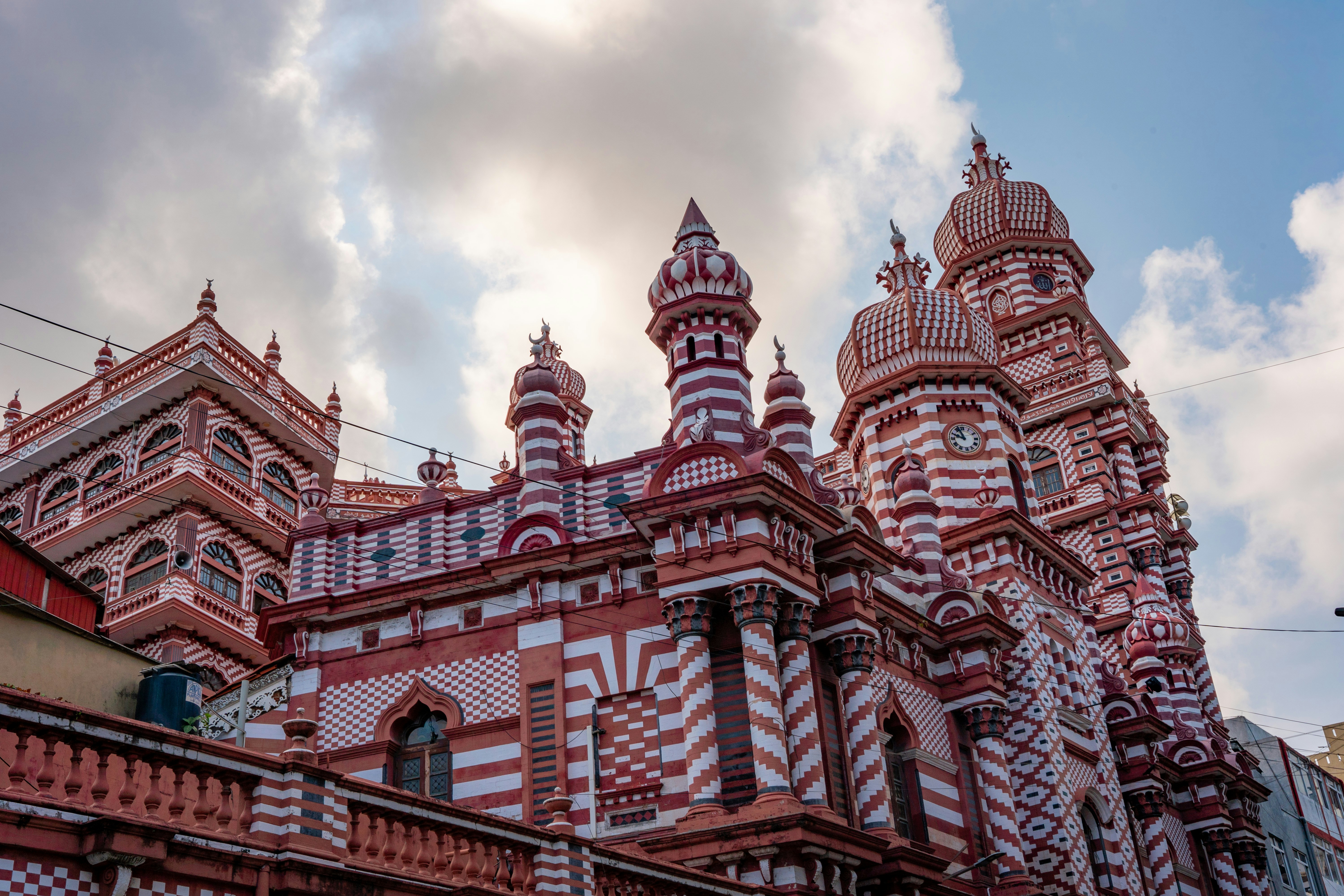 Candy-striped Cathedral Spires Under a Cloudy Sky