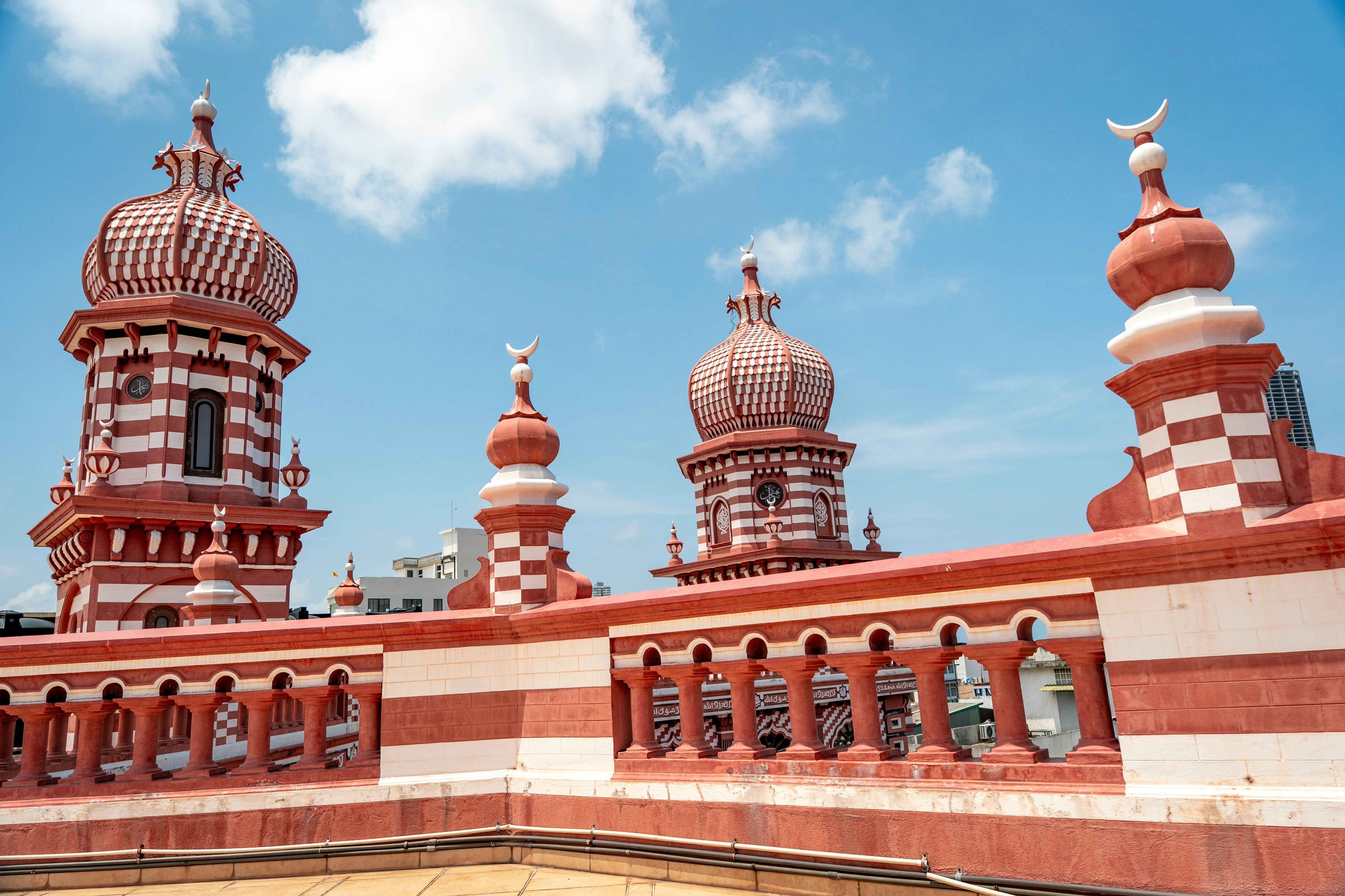 Red Terracotta Domes Against a Bright Blue Sky