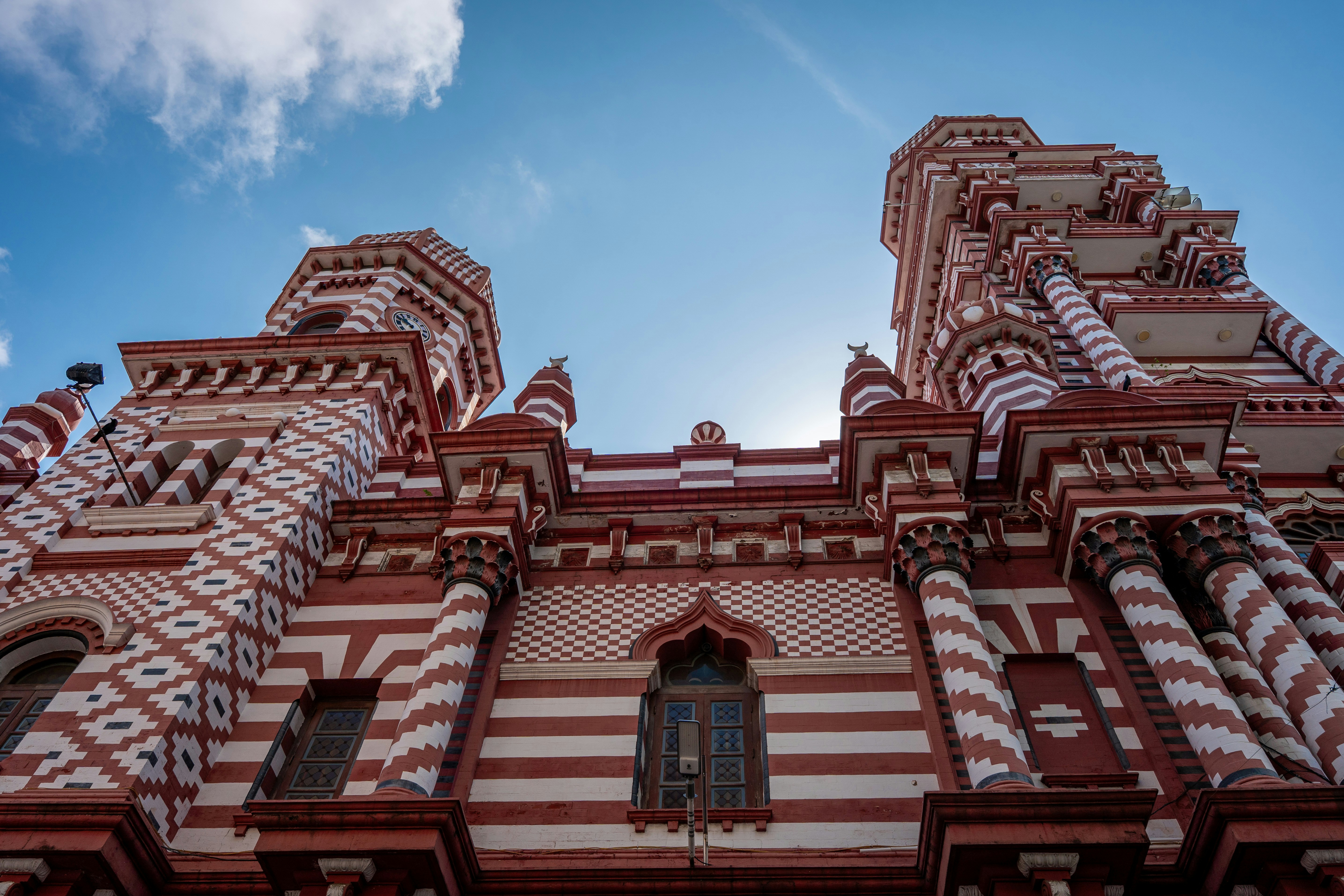 Red Brick Towers Reaching Toward the Blue Sky
