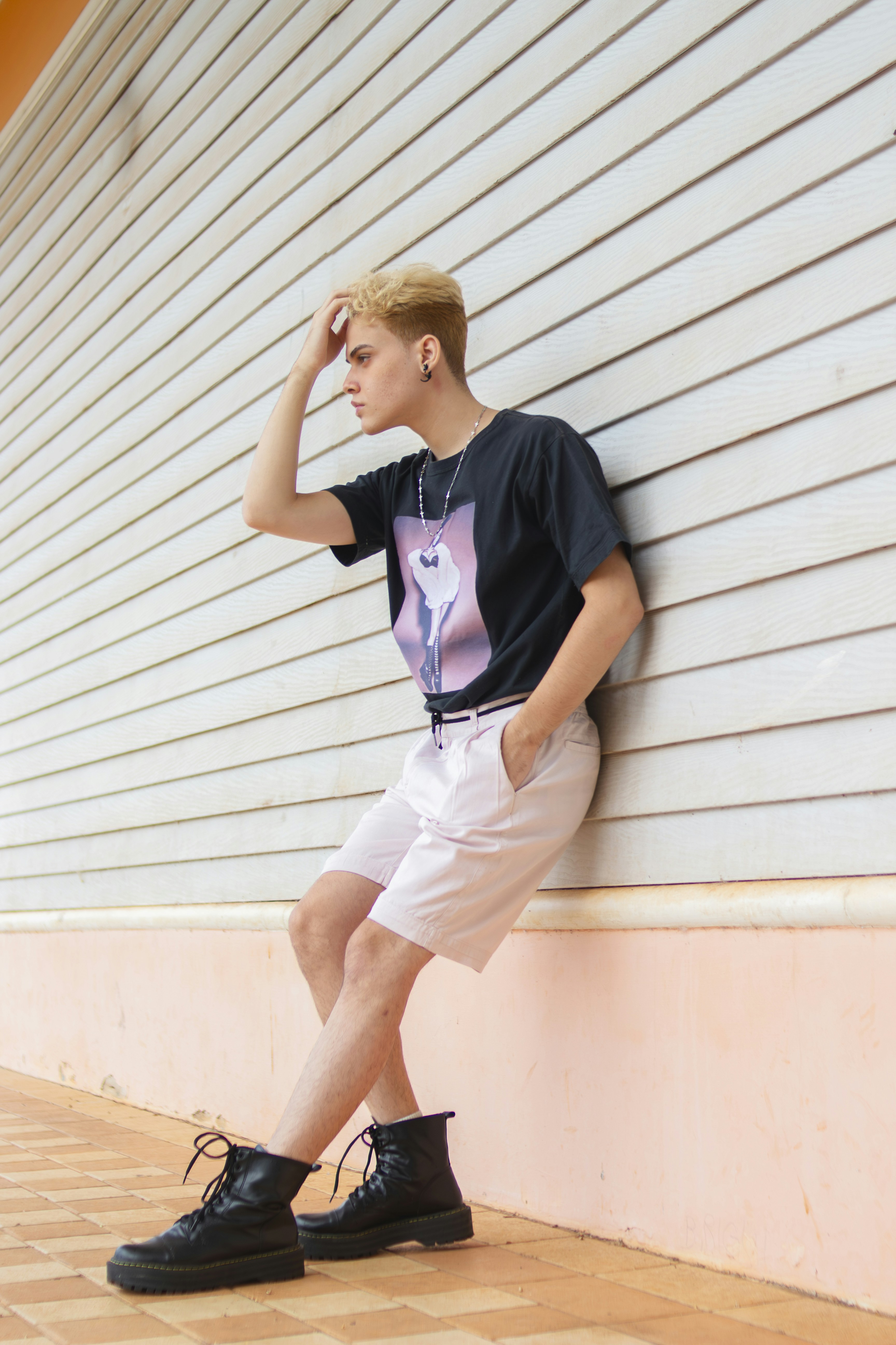 Casual Edge: A Rebel Stance by the Wall