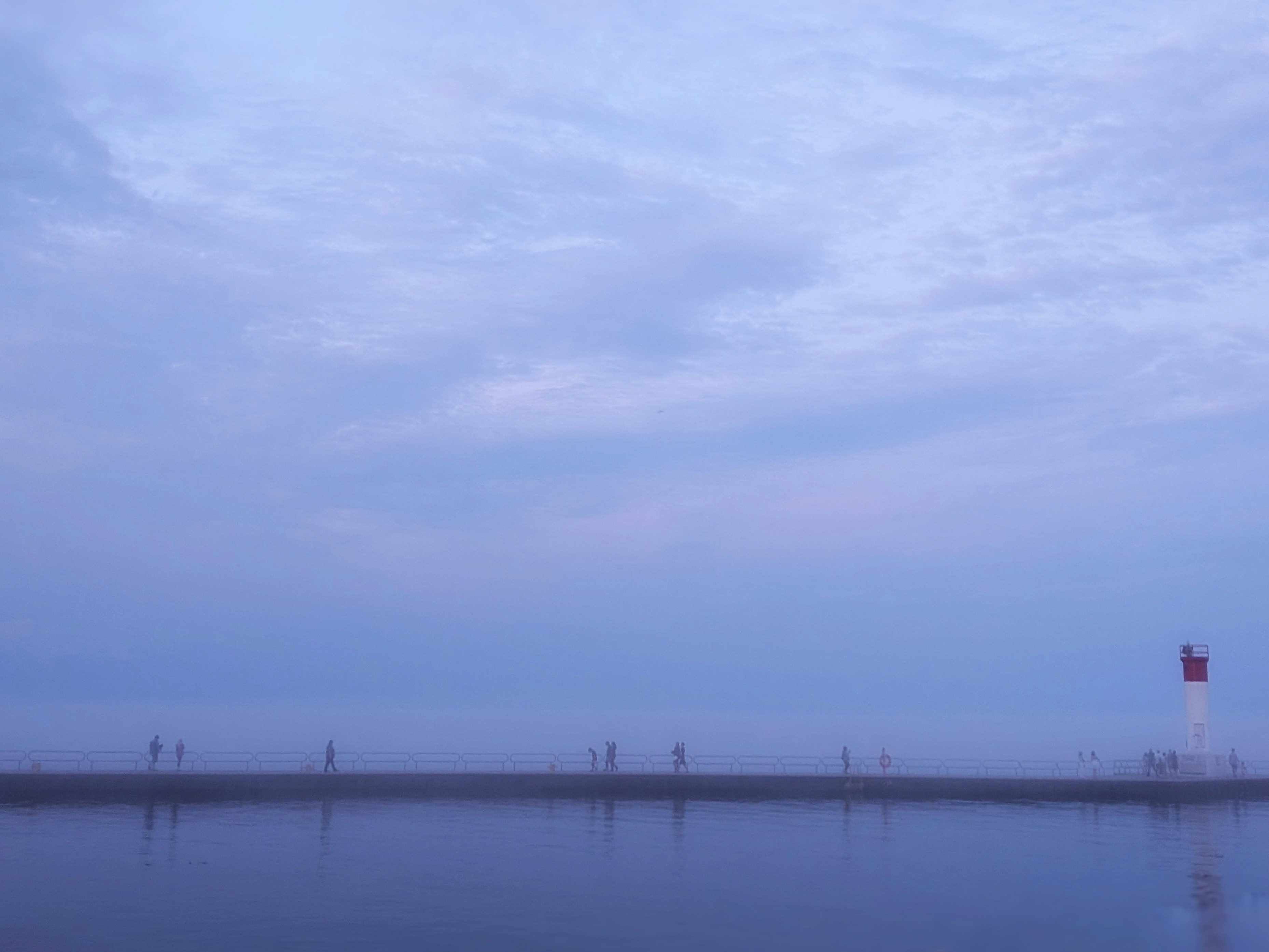 Horizon Wisp: A Quiet Seafront Under a Pale Sky