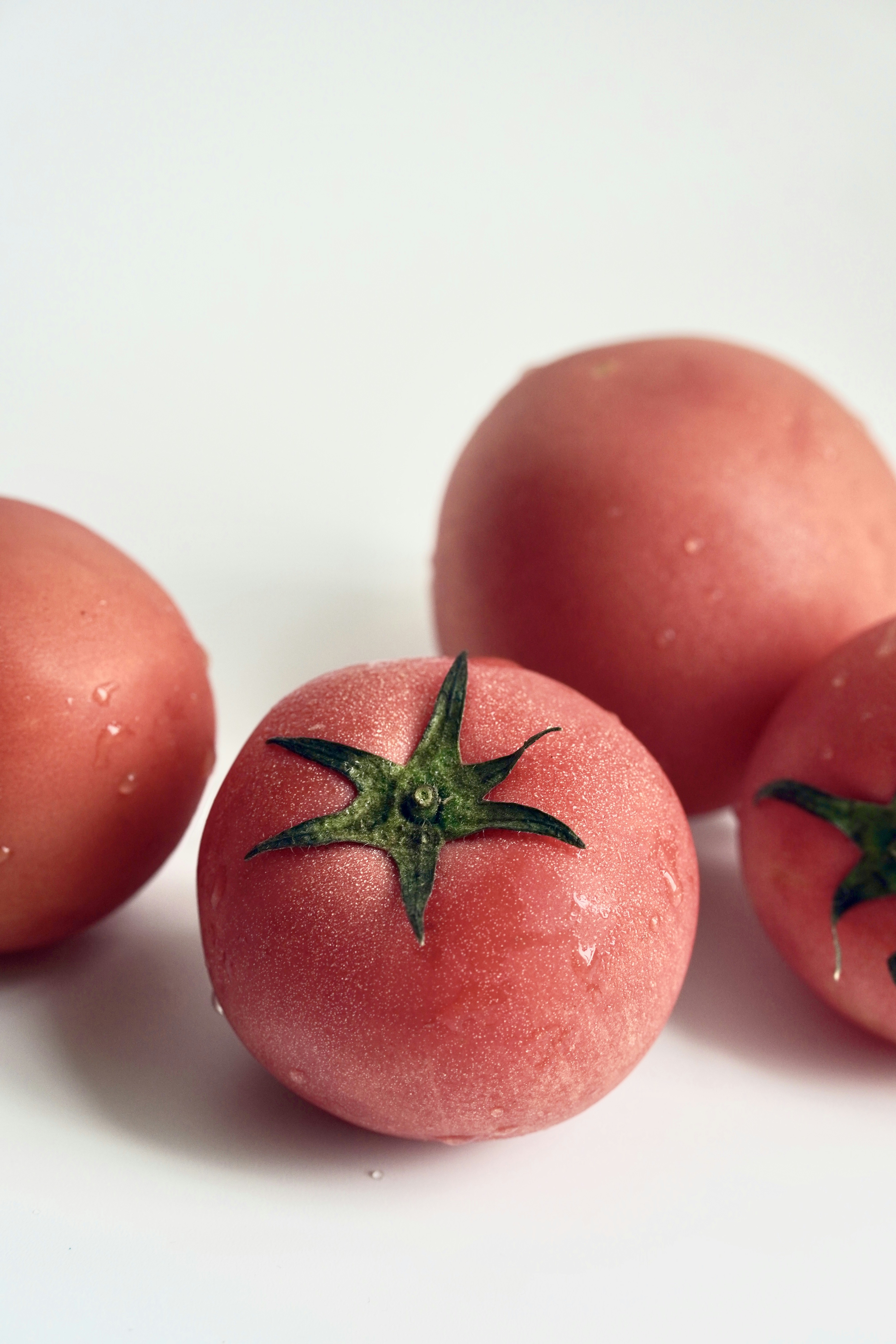 Crimson Center: A Trio of Dew-kissed Tomatoes
