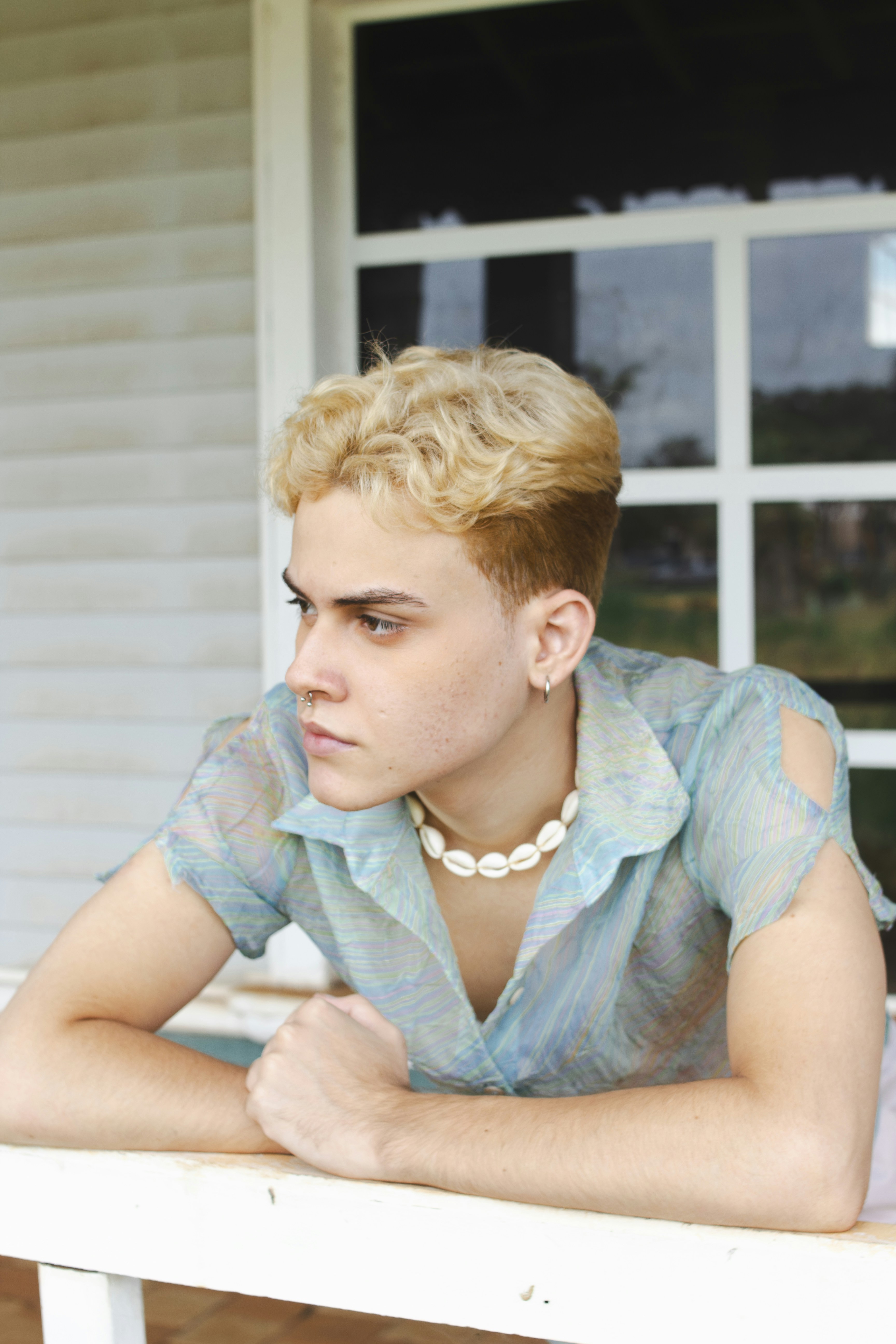 Quiet Confidence: Portrait on a Shaded Porch