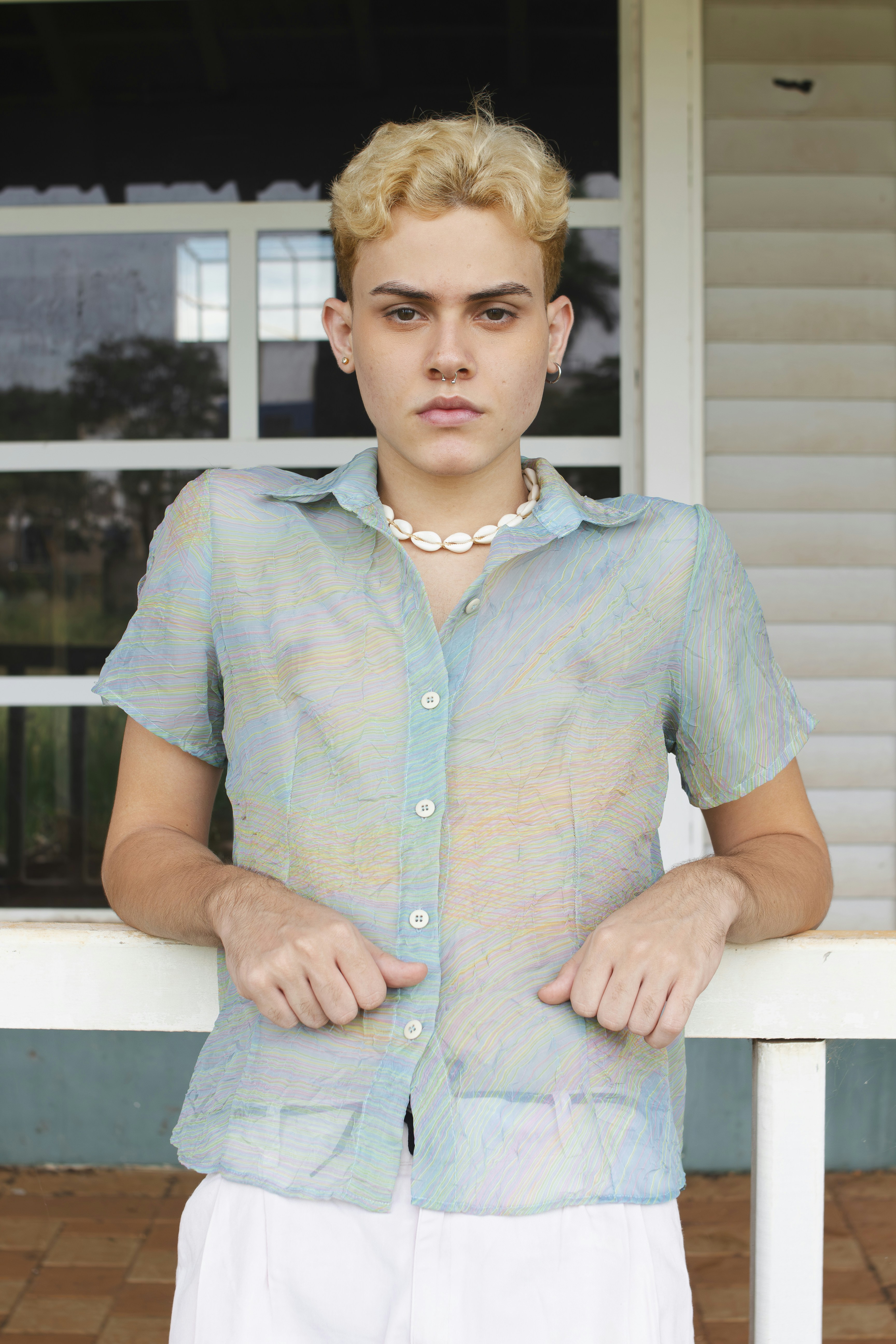 Portrait at the Porch: A Confident Breeze in Pastel Button-Down