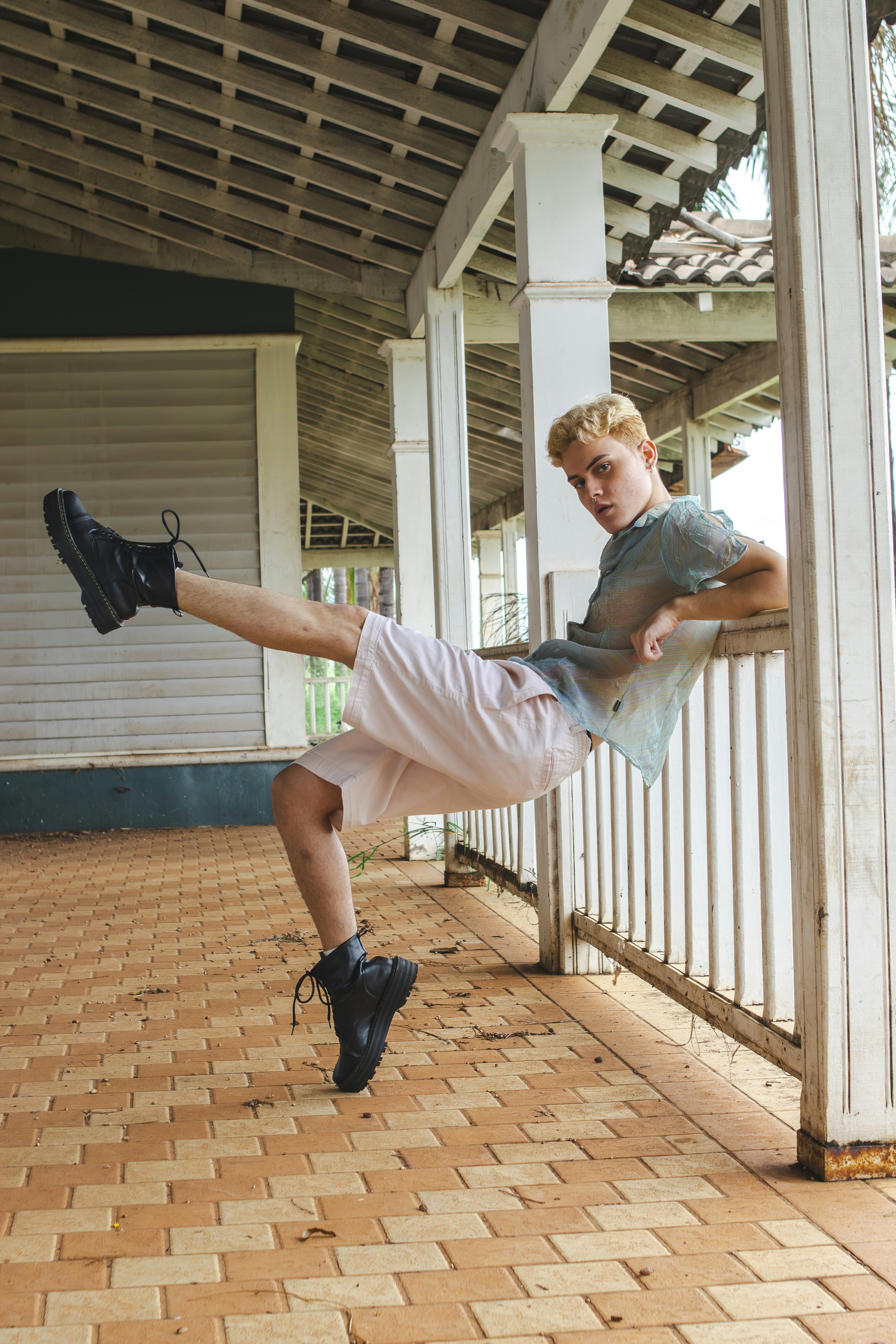 Leaning Off the Rail: A Fluid Kick on Sunlit Tiles