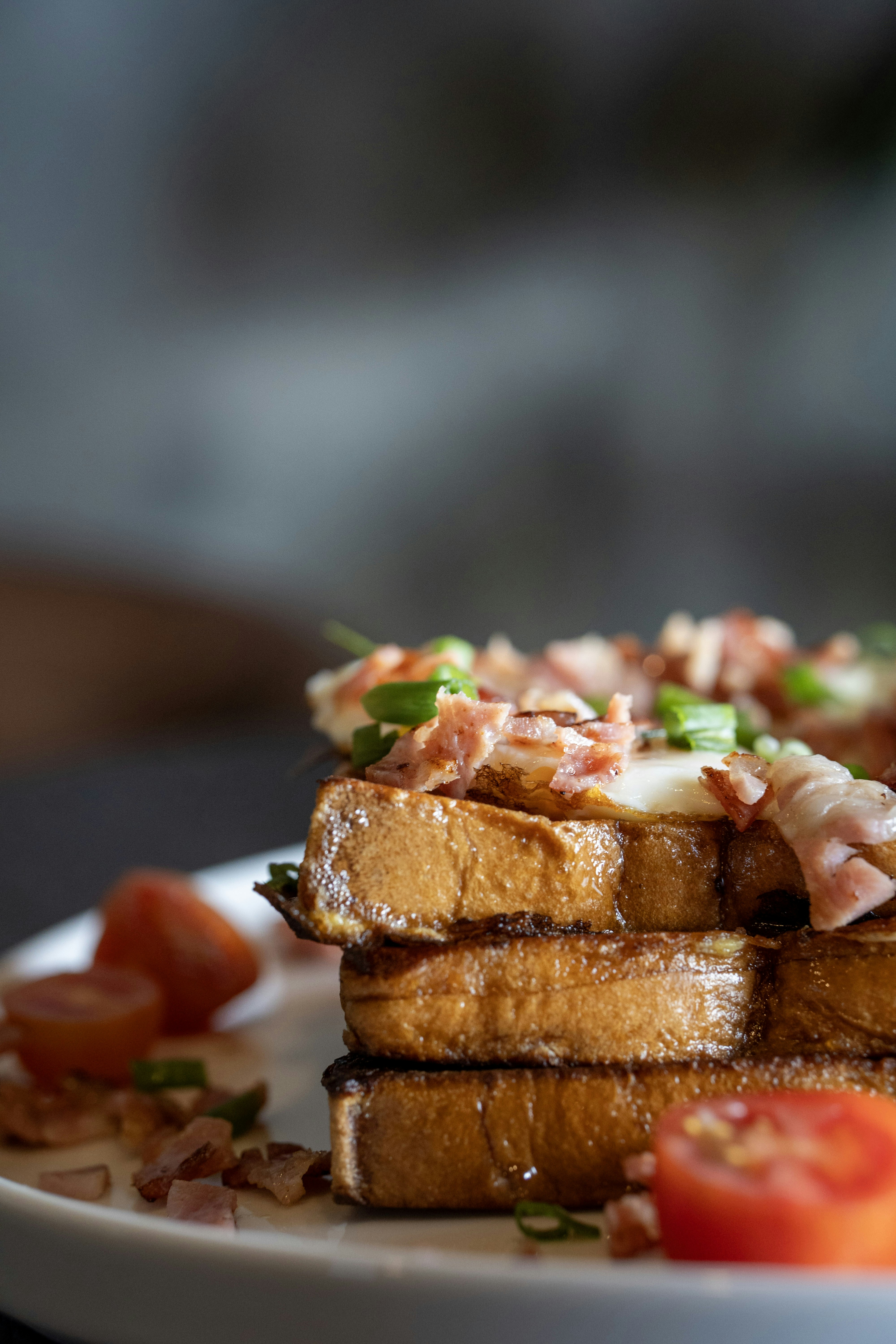 Stacked Crunch: Ham and Herb Toast Points on a Rustic Plate
