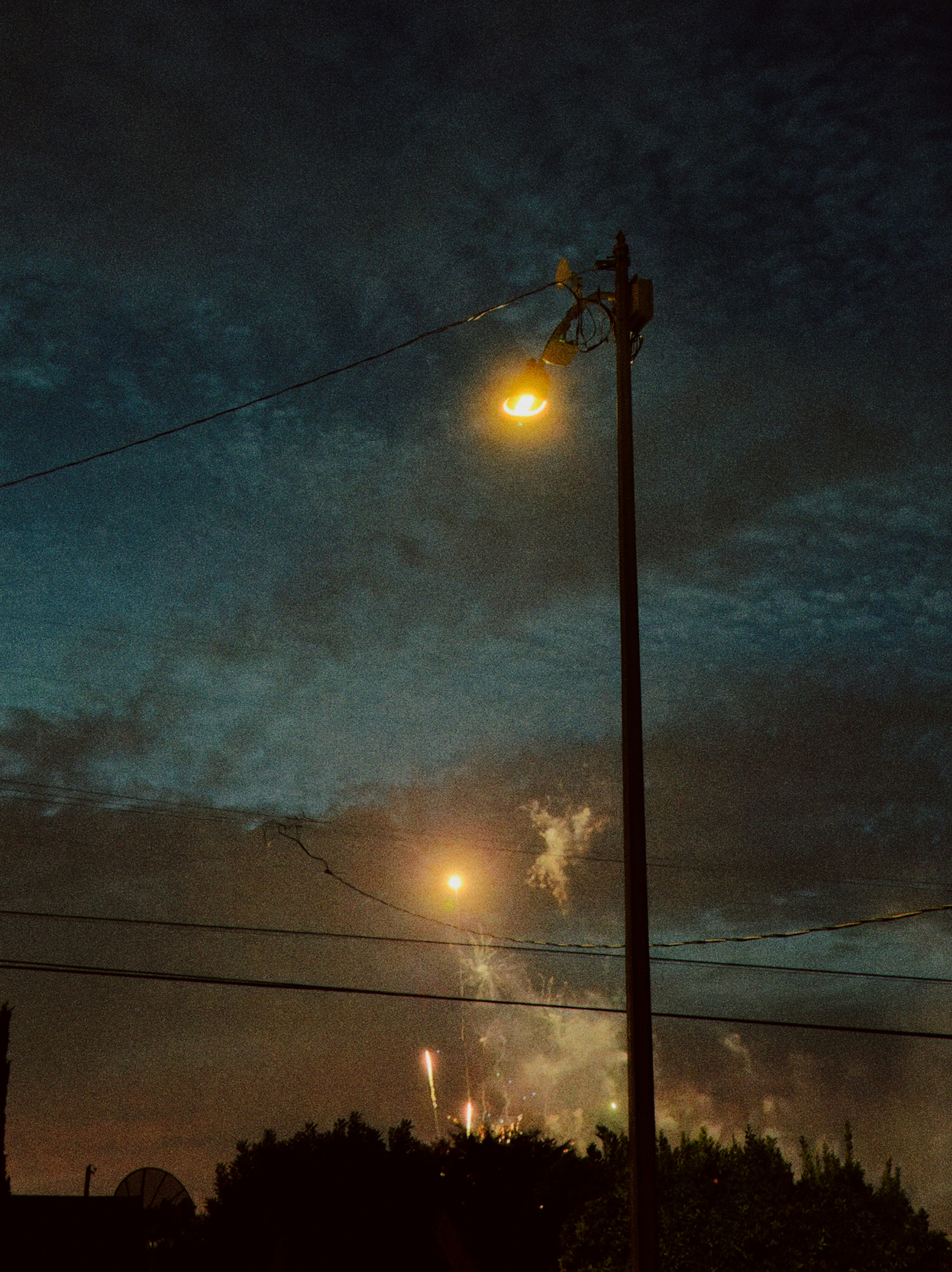 Evening Streetlight Reverie over a Quiet Suburban Horizon