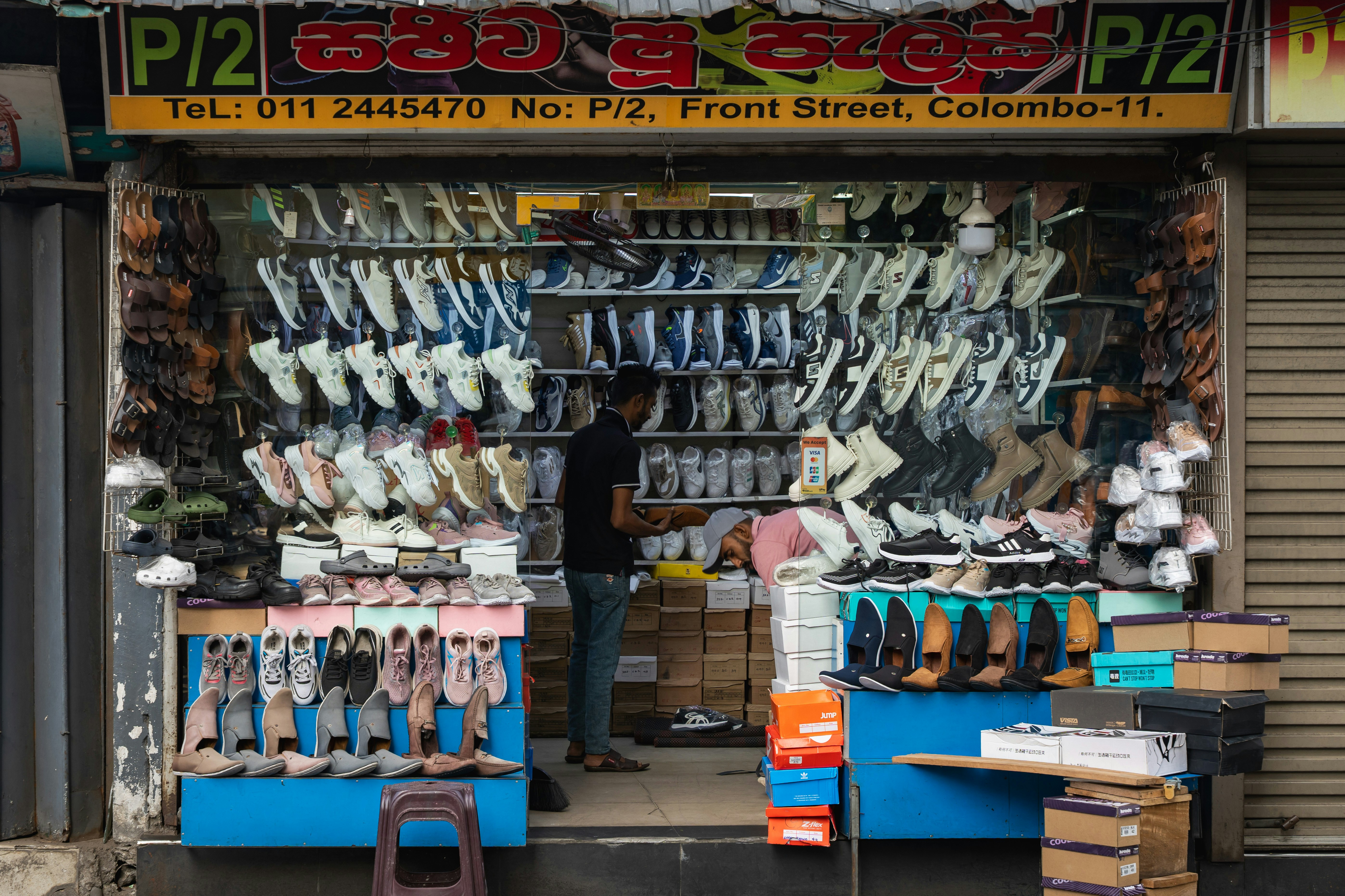 Shoes on Display: A Busy Street-Side Footwear Stall