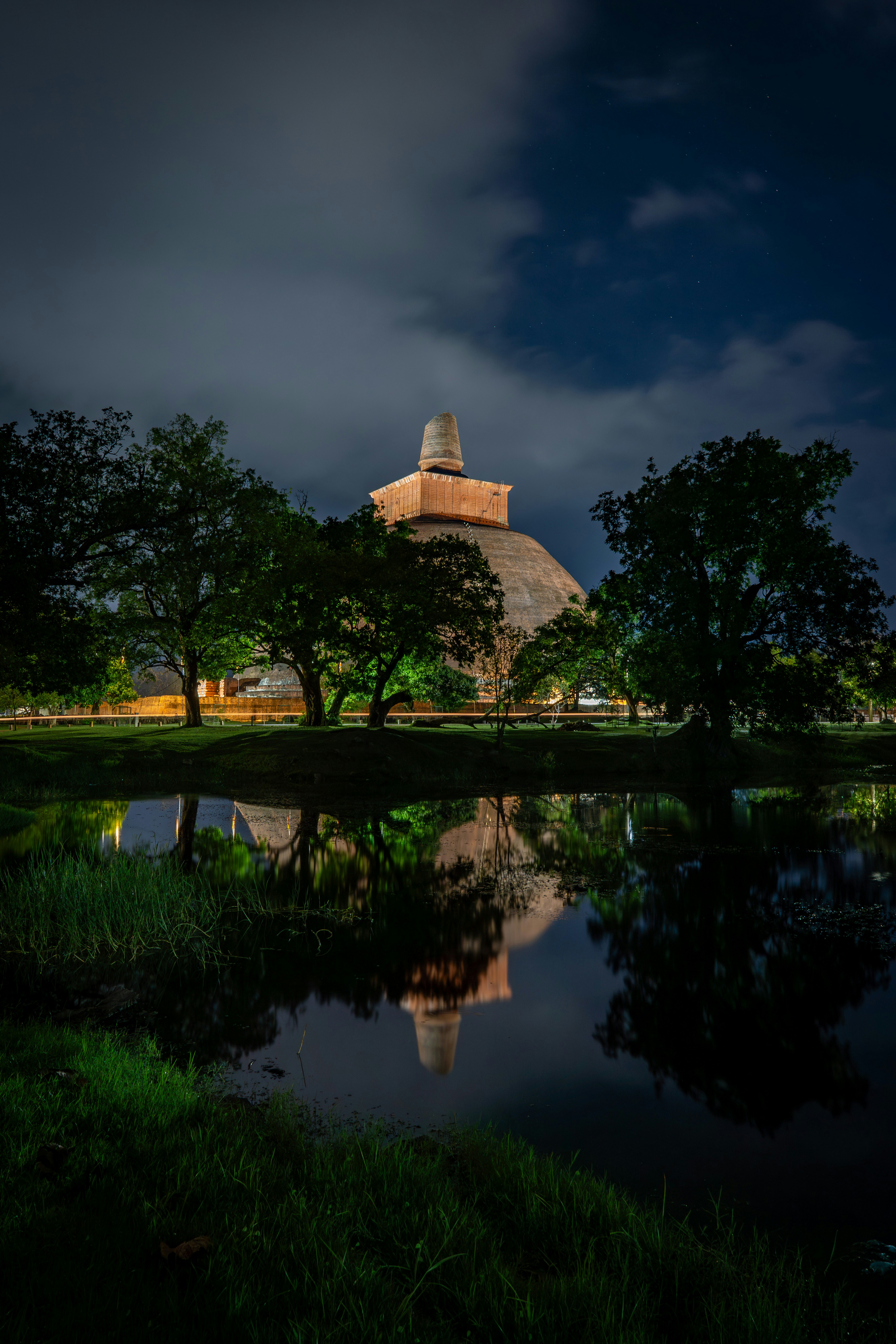 Moonlit Stupa: Silent Reflection Over a Sacred Lake