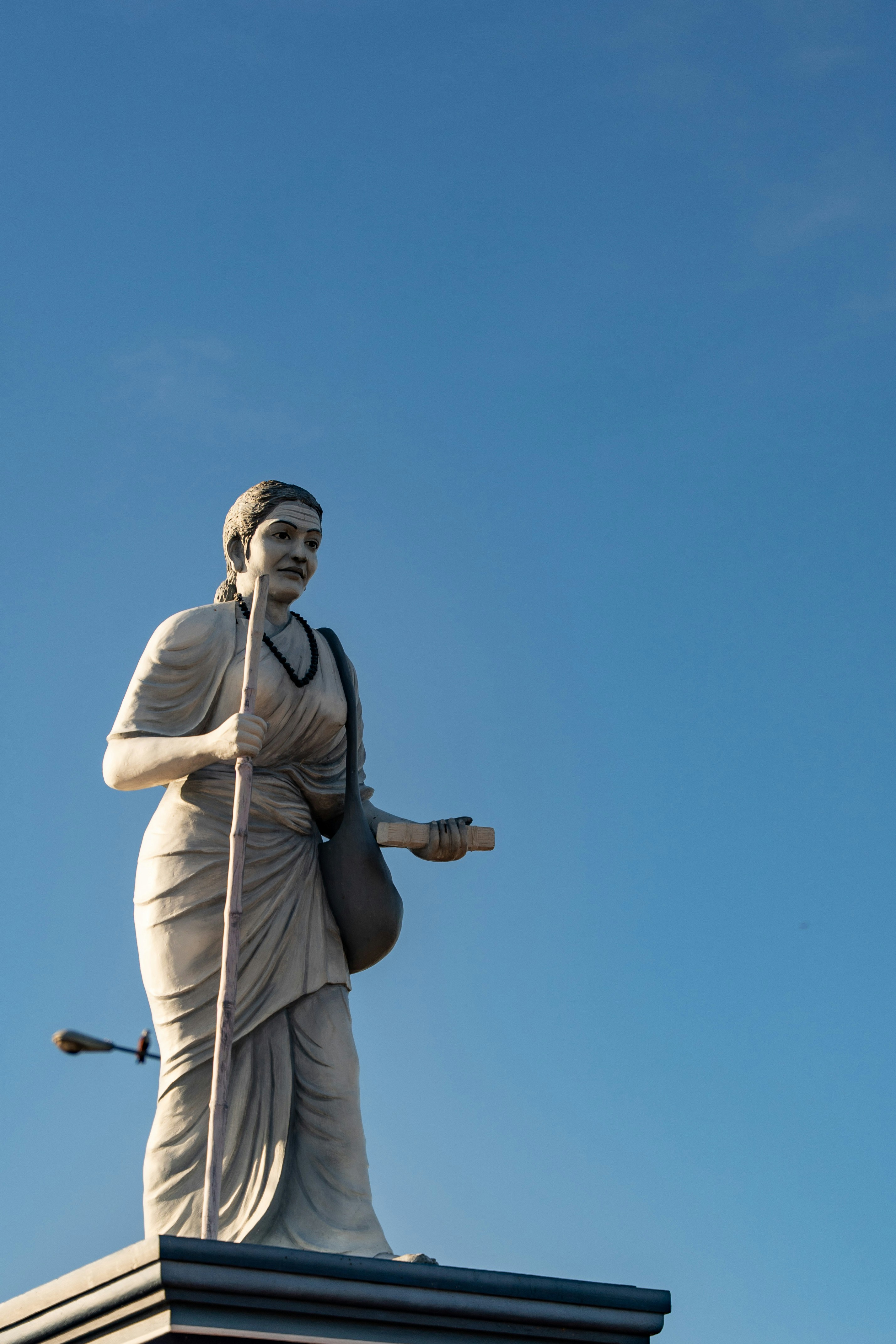 Stride of Serenity: A Statue Reaching Toward the Sky