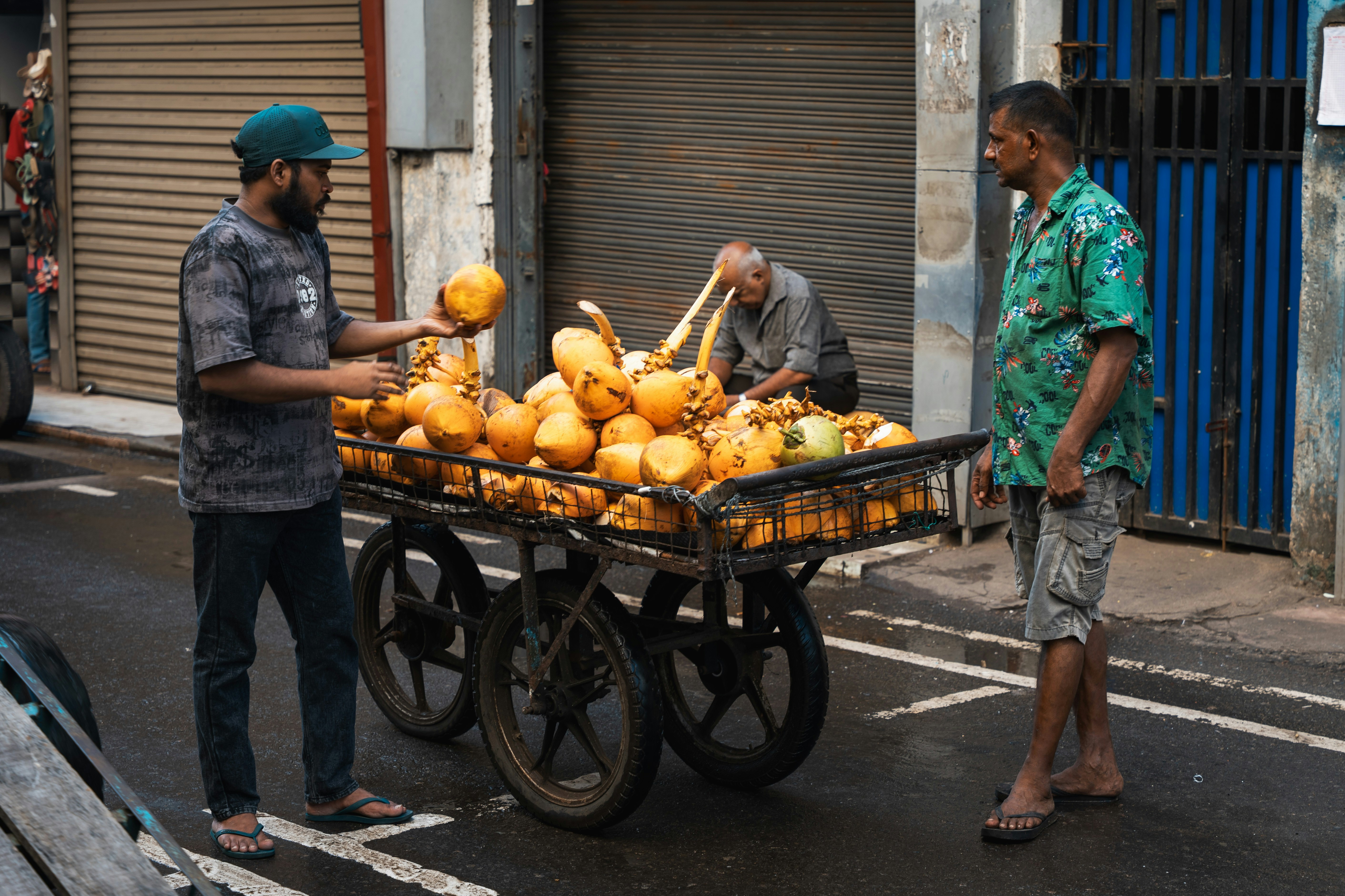 Street Fruit Cart Conductor: A Moment of Quiet Exchange